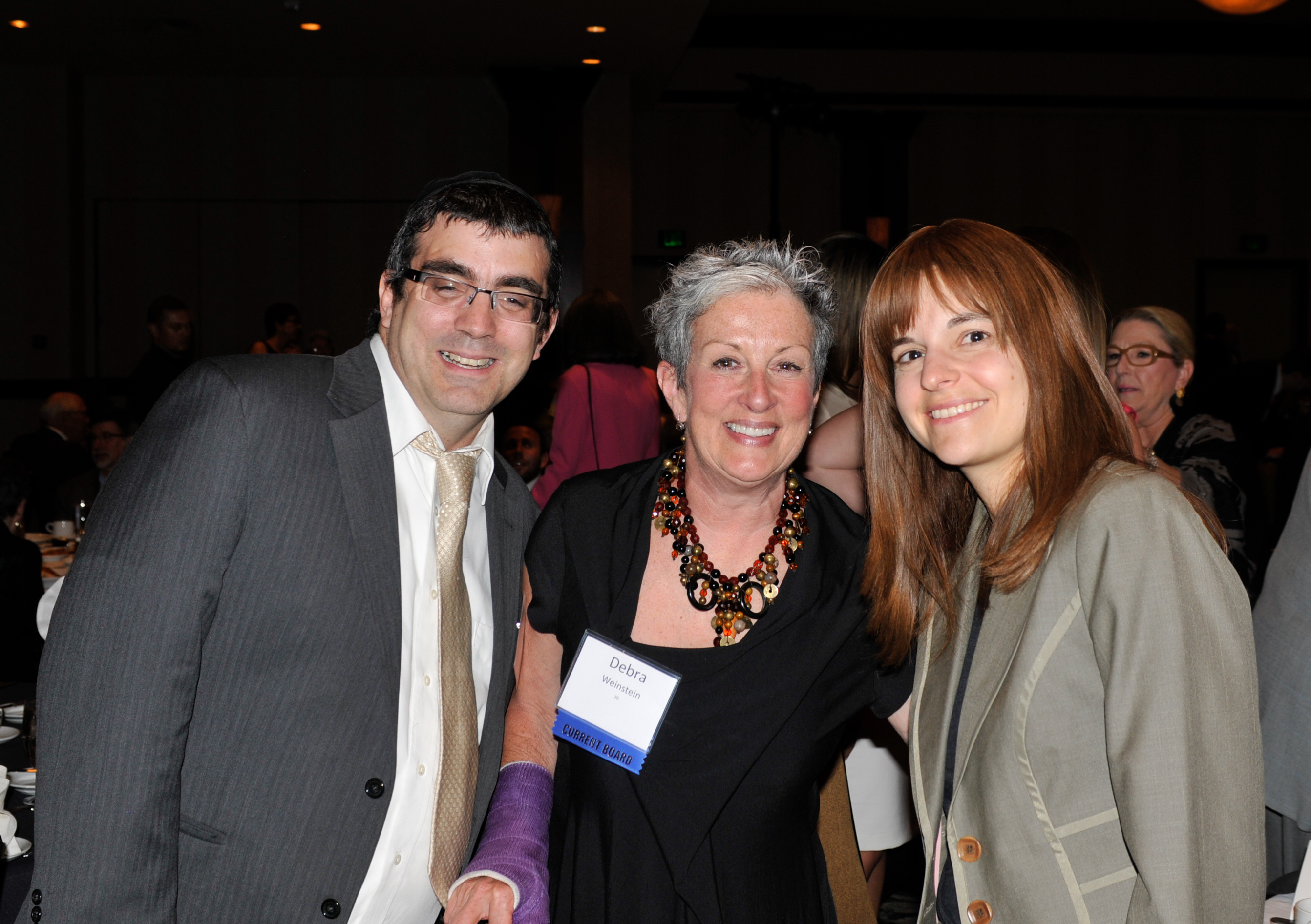 Charles Goldstein, left, Debra Weinstein (board) and Andrea Goldstein