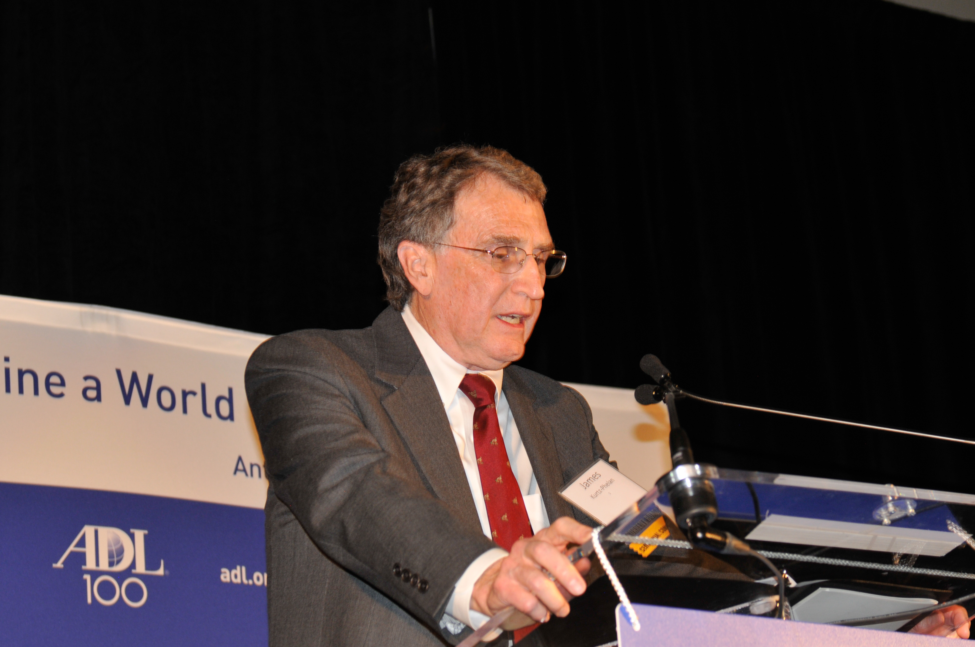 Event Co-Chair James Kurtz-Phelan gets ready to bestow the ...