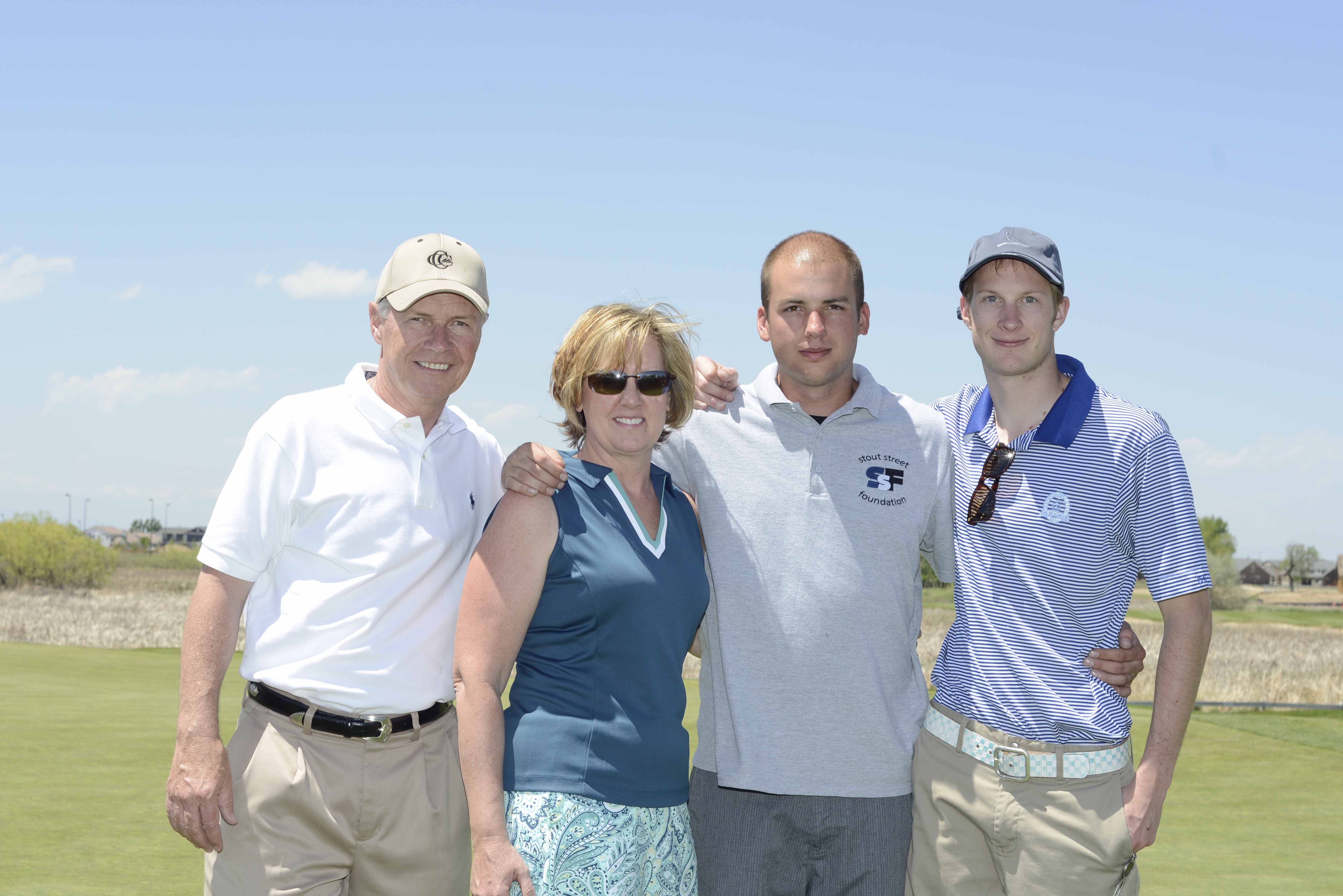 Family foursome Tim Stack, left, with wife Debbie and sons Matt and Nate