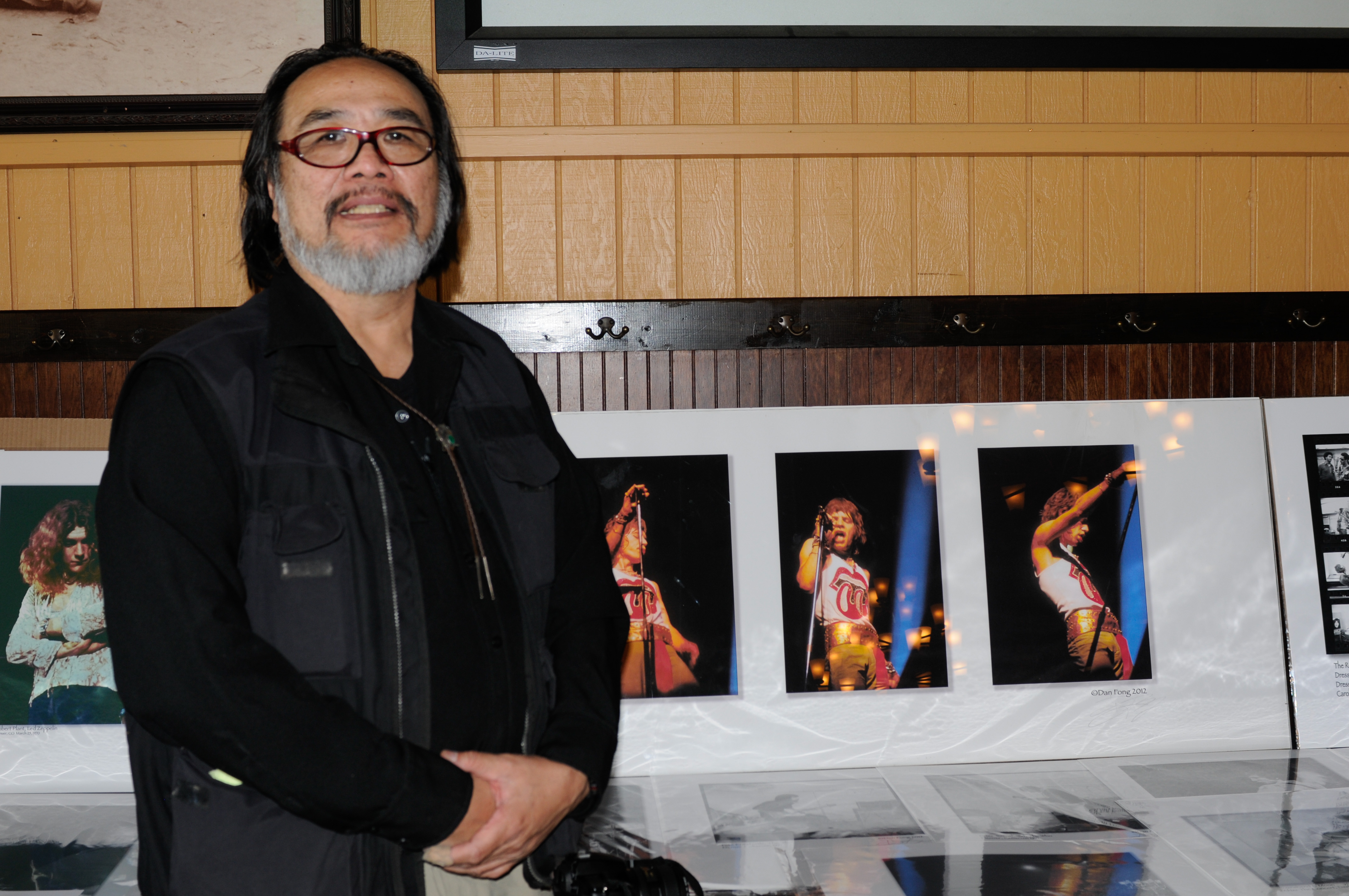 Dan Fong stands before some of his rare, never-before-released photos ...