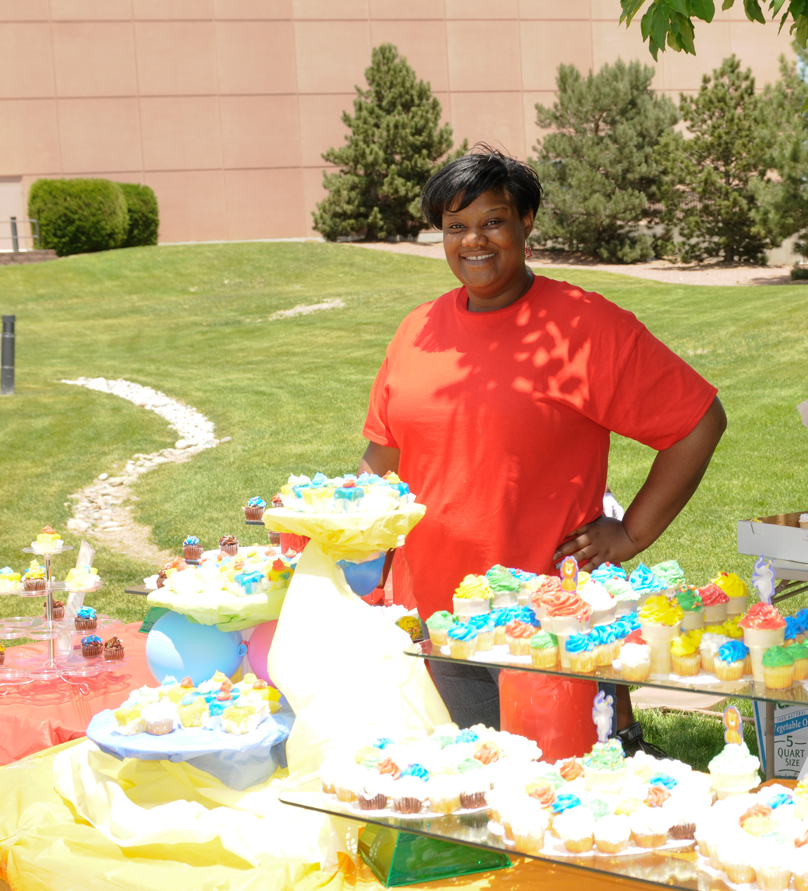Rene Hawkins greets everyone with "birthday" cupcakes