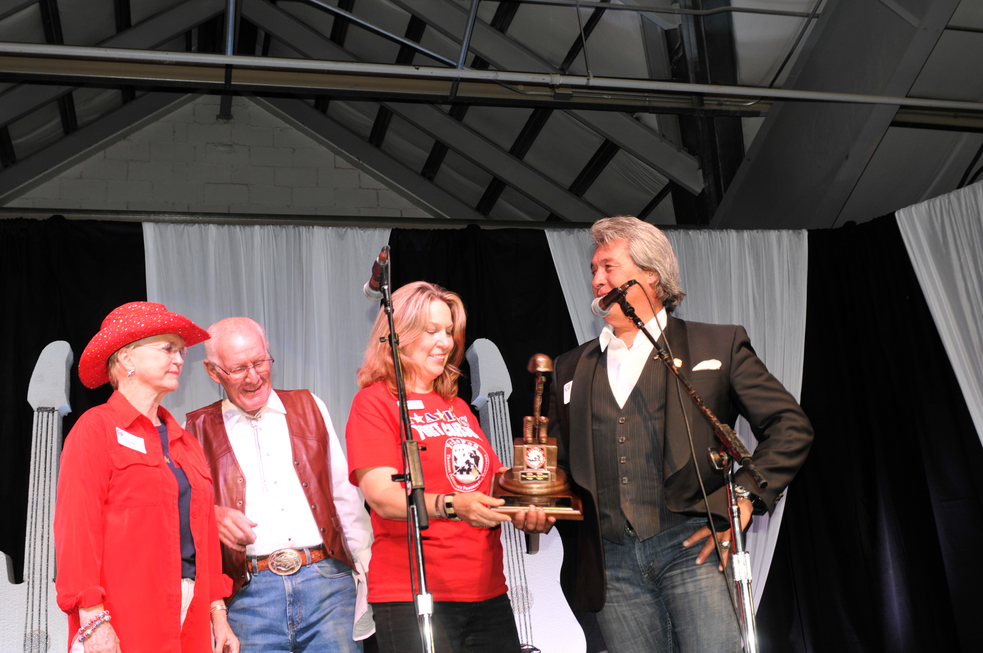 Lynne and Bo Cottrell, left, and Bonnie Carroll giving an appreciation ...