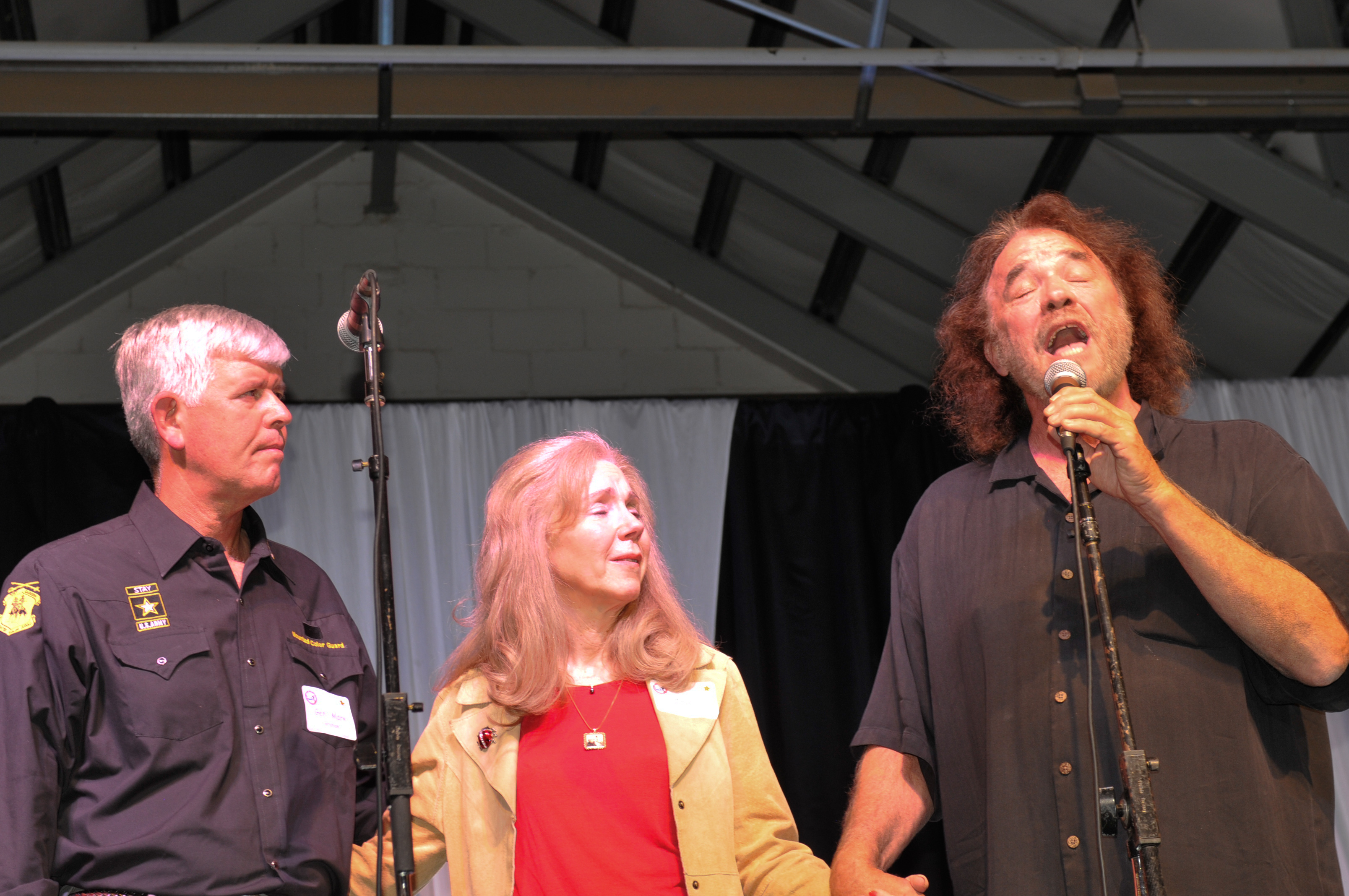 MajGen (ret.) Mark and Carol Graham watch as legendary performer Gary ...
