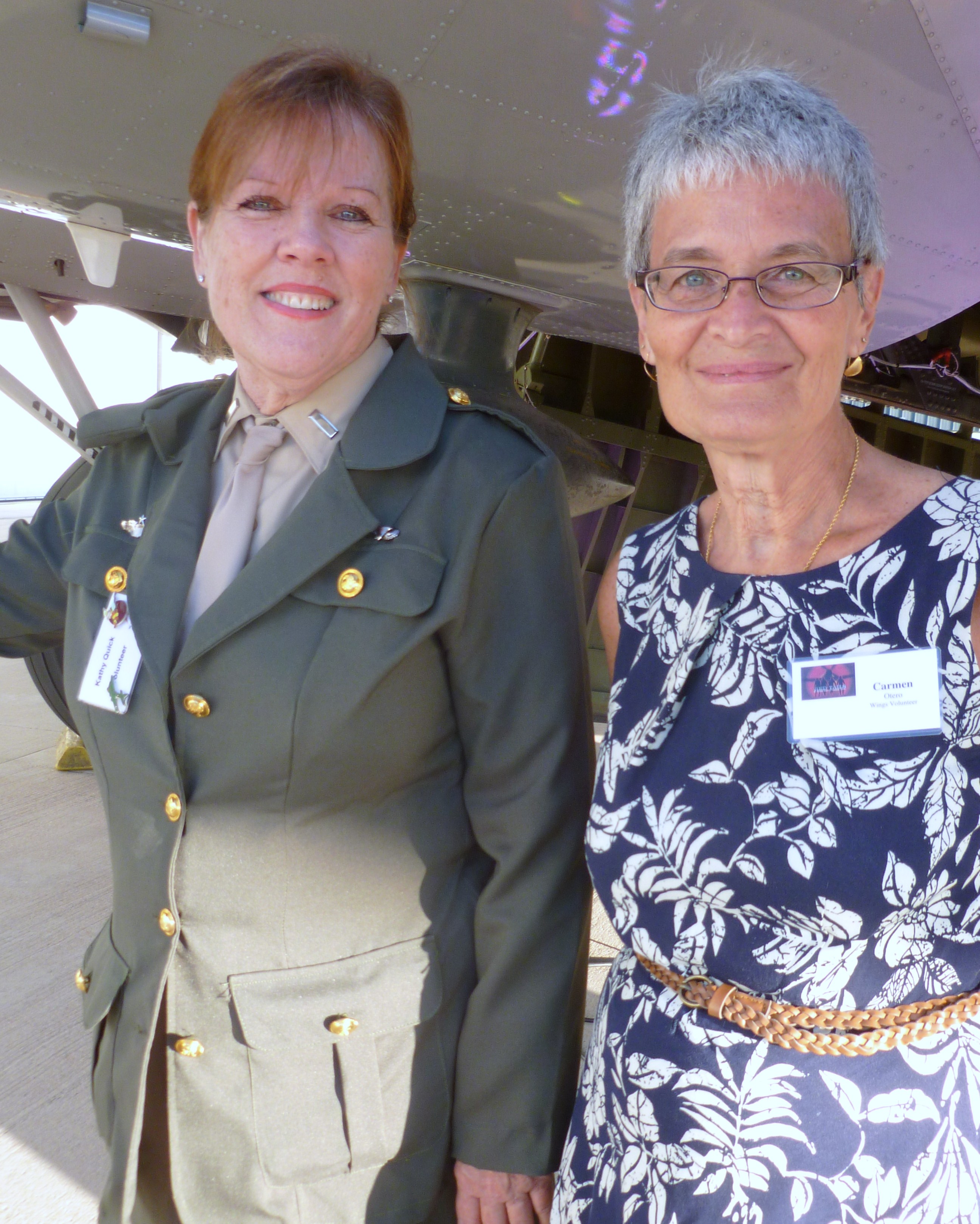 Volunteers Kathy Quick (left) and Carmen Otero help out with the B-17 ...
