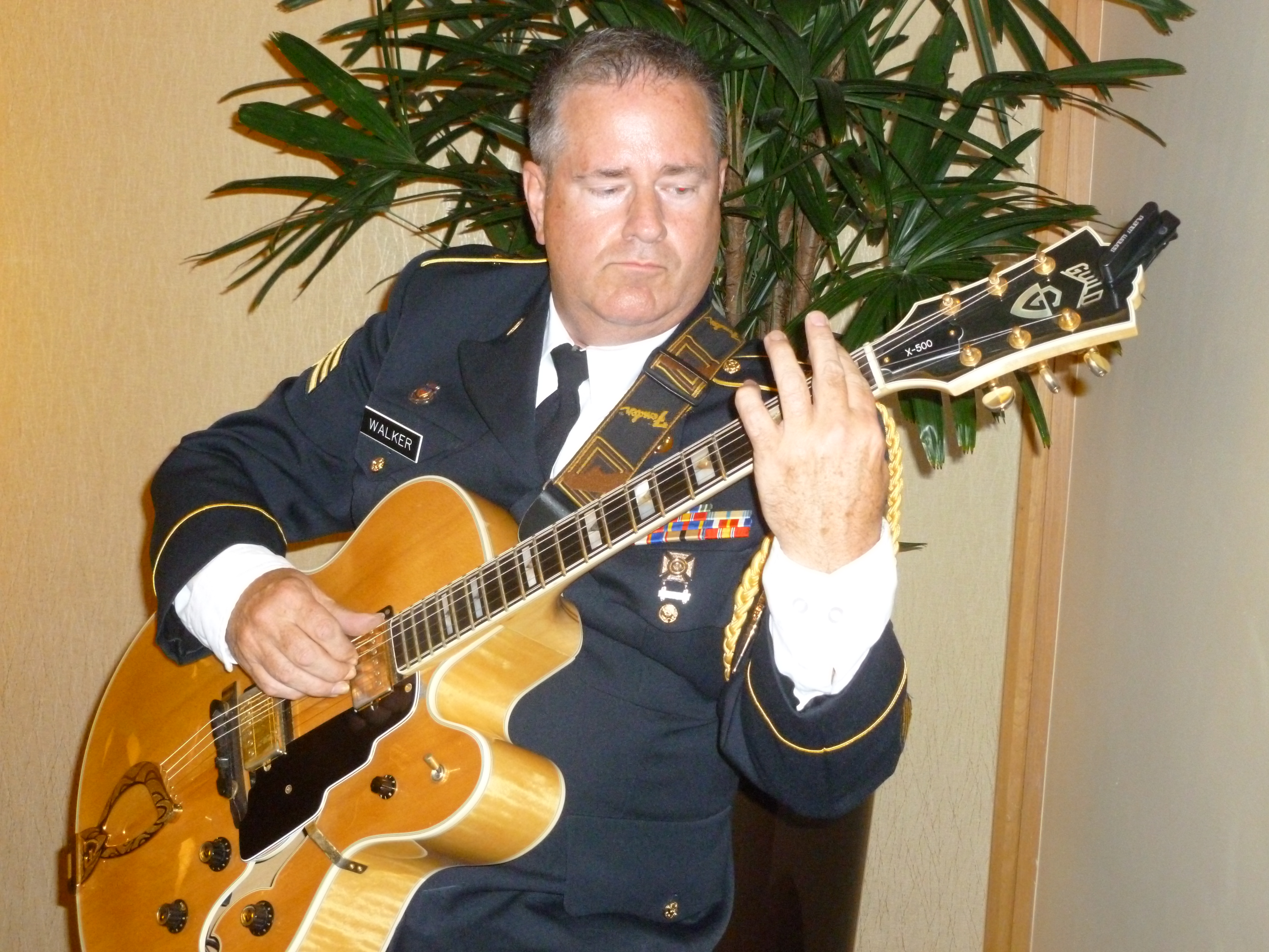 Sgt. Lou Walker, of the 101st Army Band, entertains during the reception.