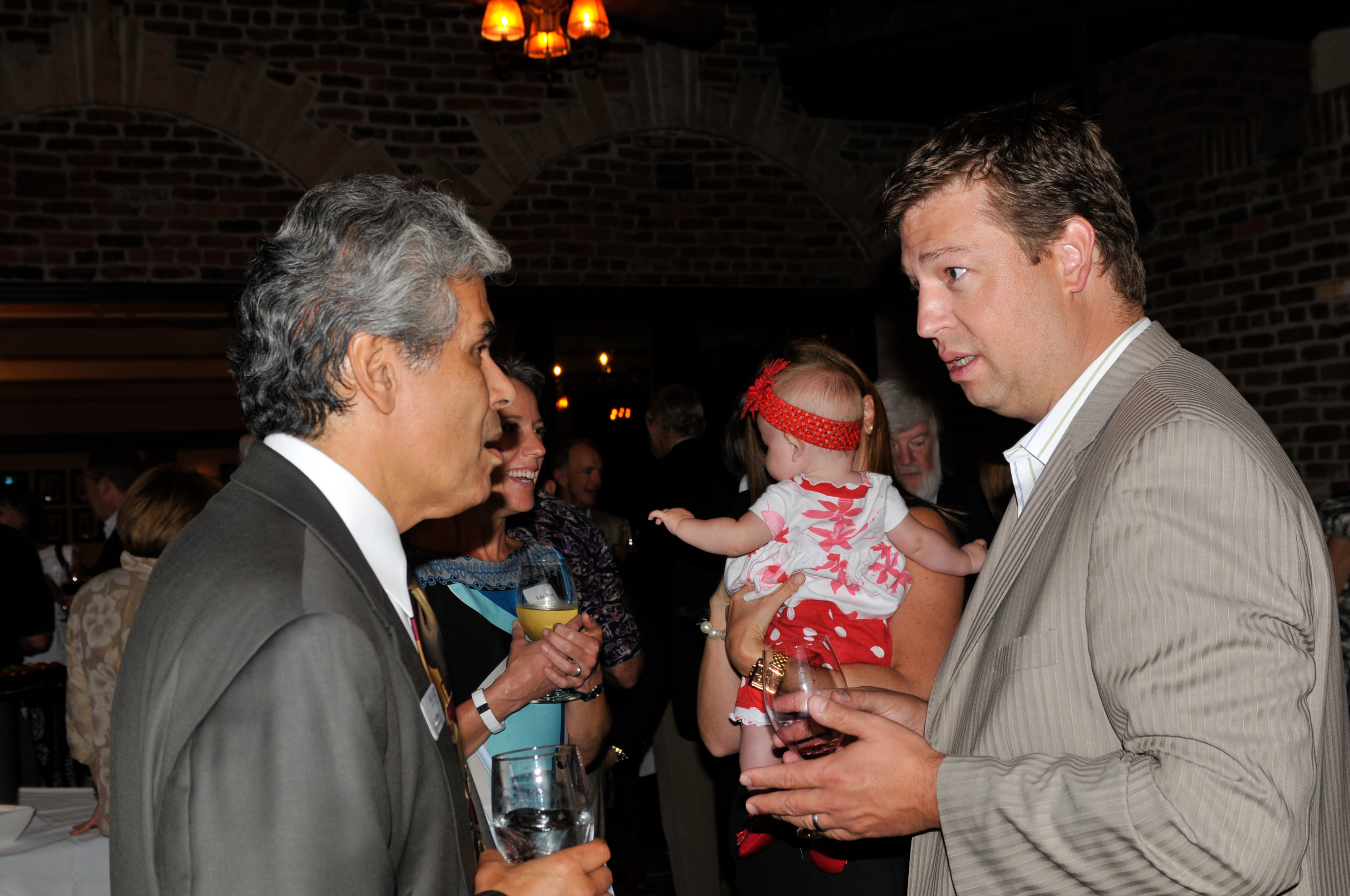 President and CEO Don Mares talks with Frank McNulty, holding Victoria