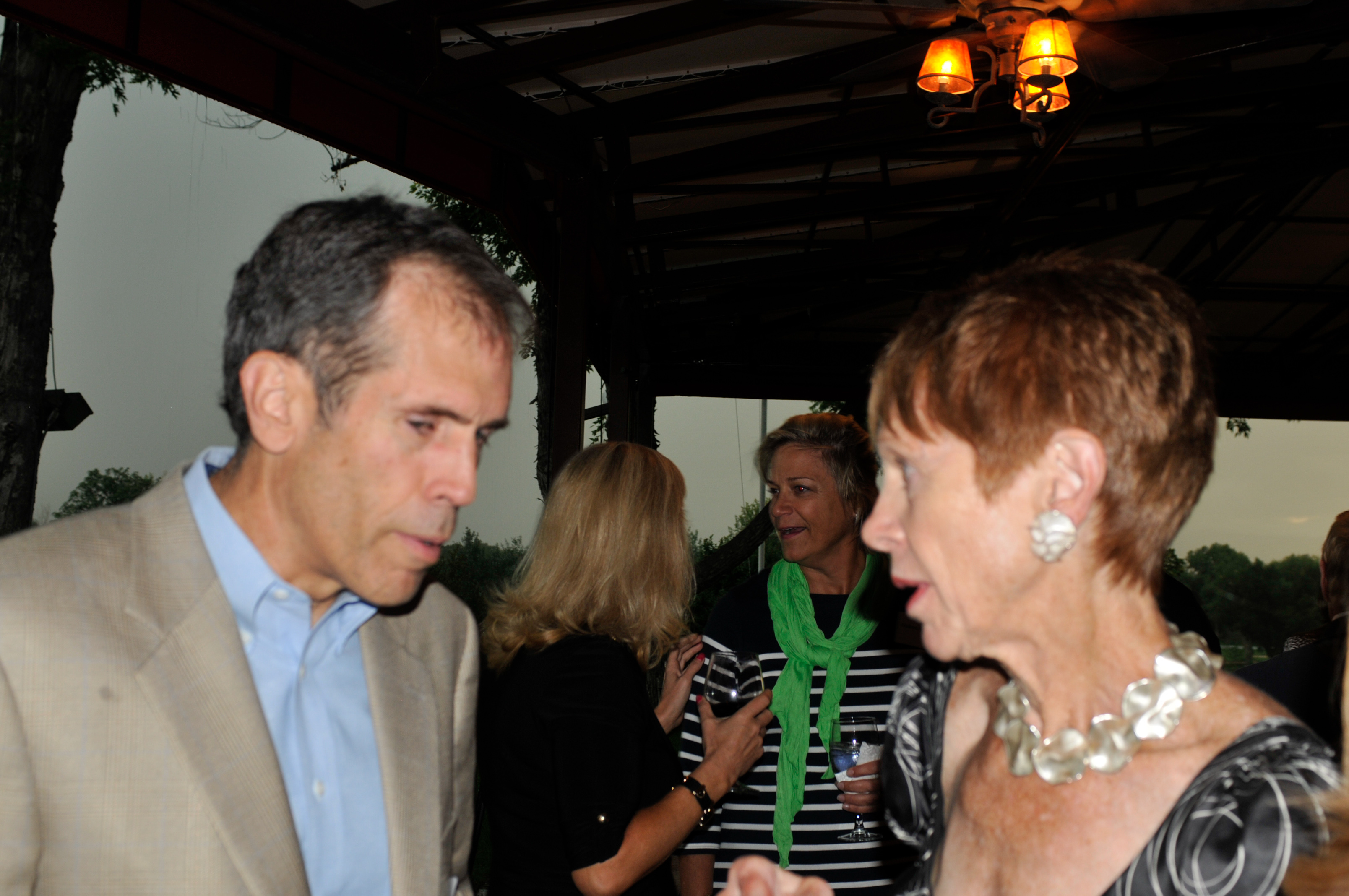 Board member Marty Waters chats with Sandra Rhodes PhD