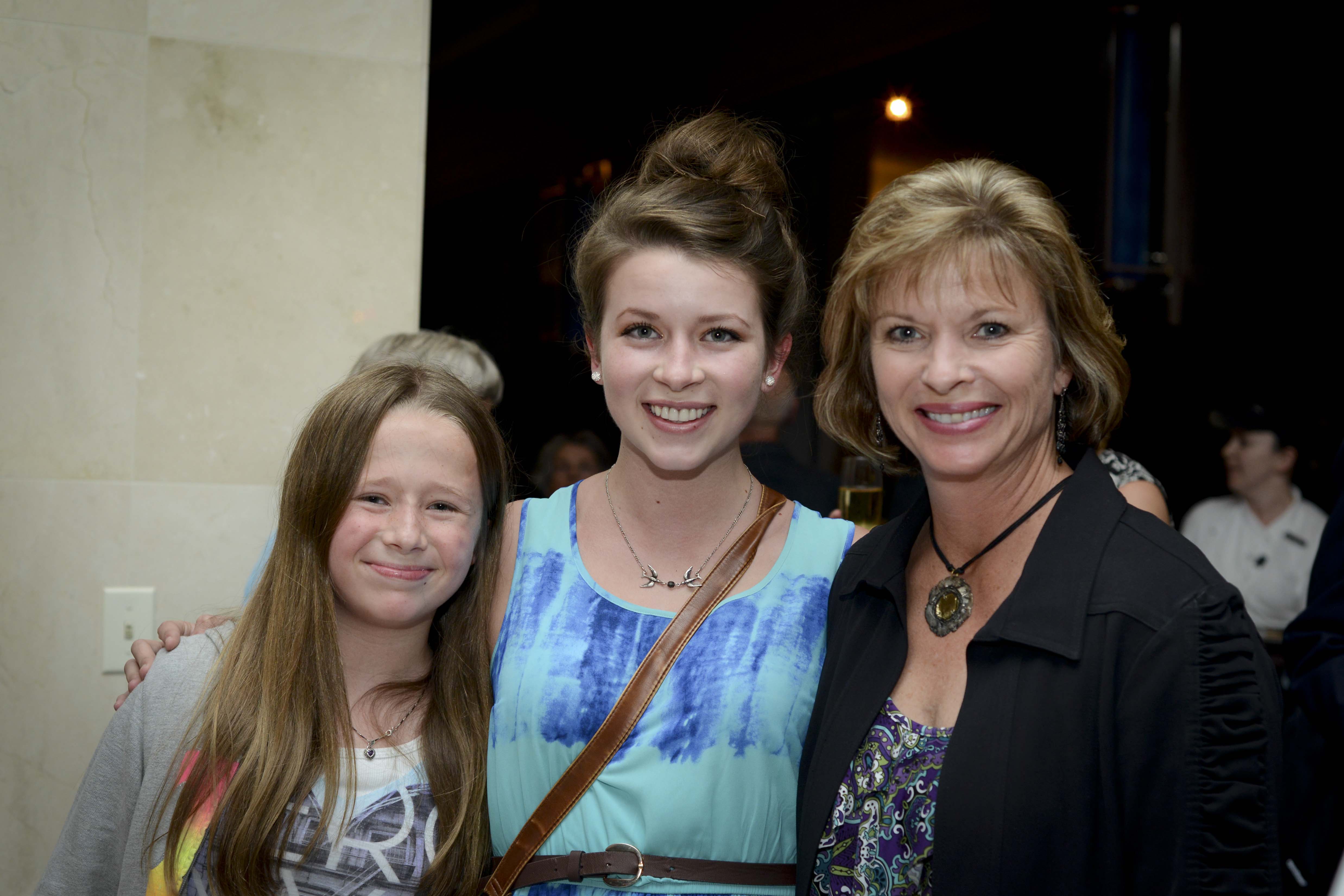 Carla Ewing, right, with daughters Claire and Myla