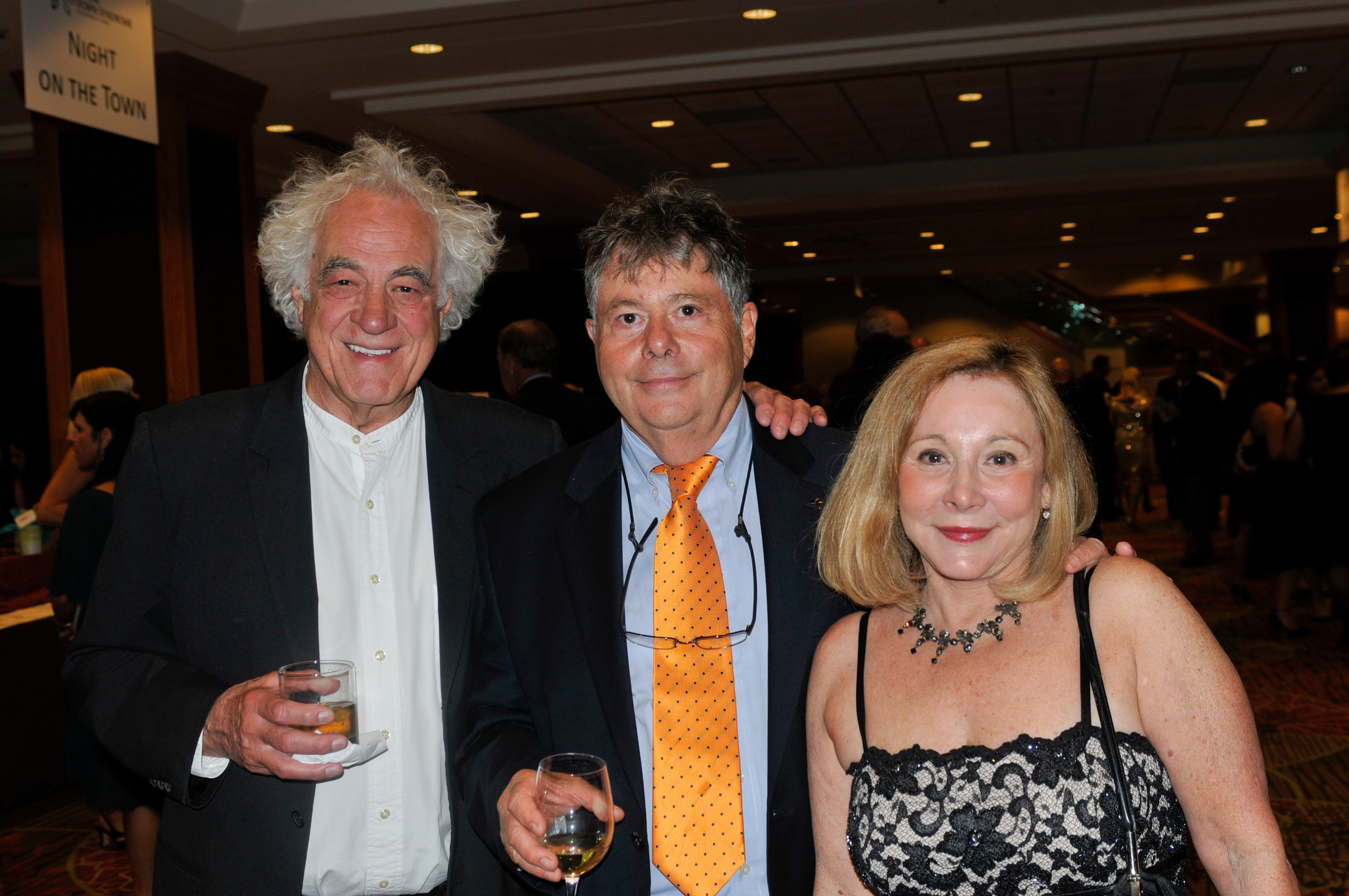 Ron Henderson, left, with David and Penny Drucker