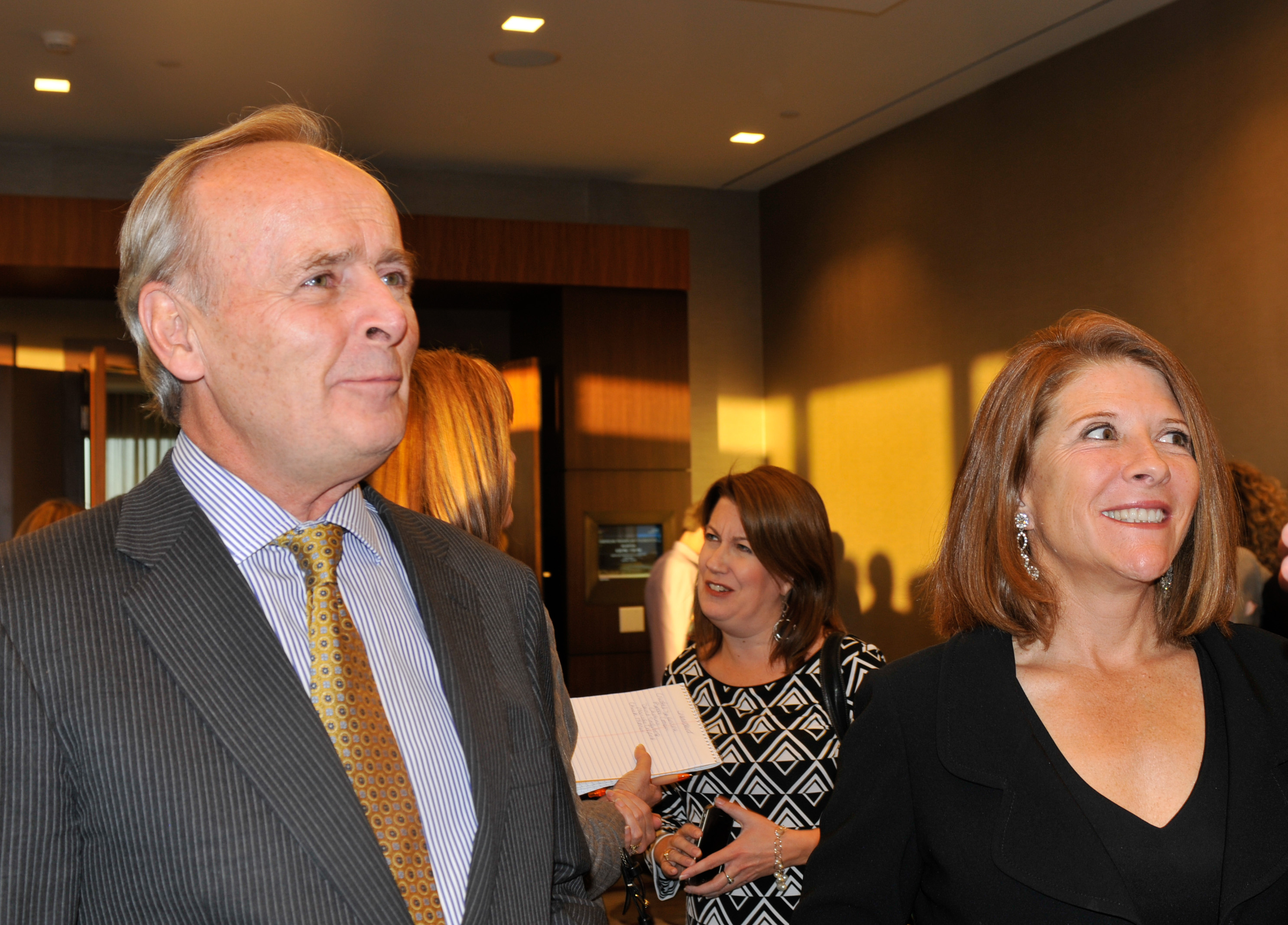 Lee and Susan McIntire listen to a comment by Norm Brownstein