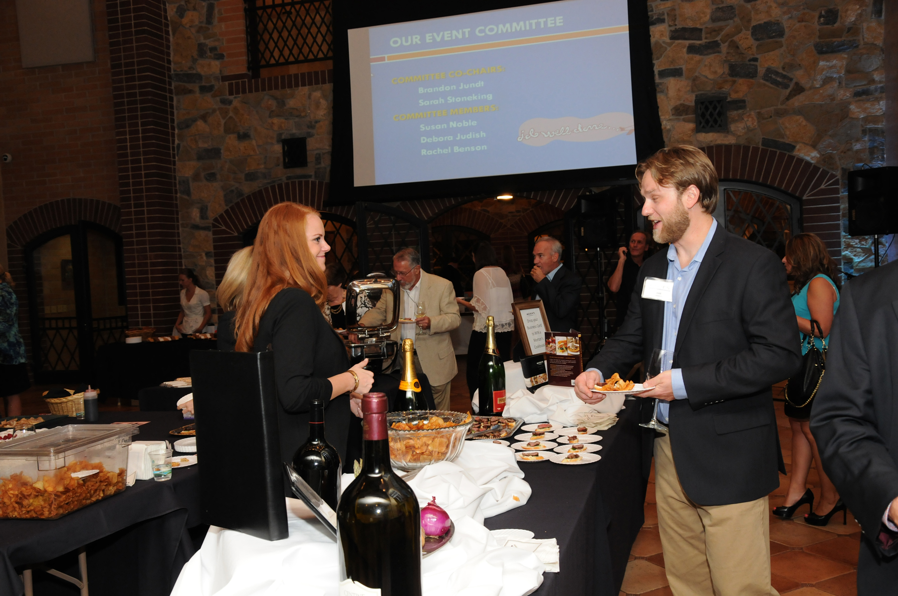Guests sampling wines and food