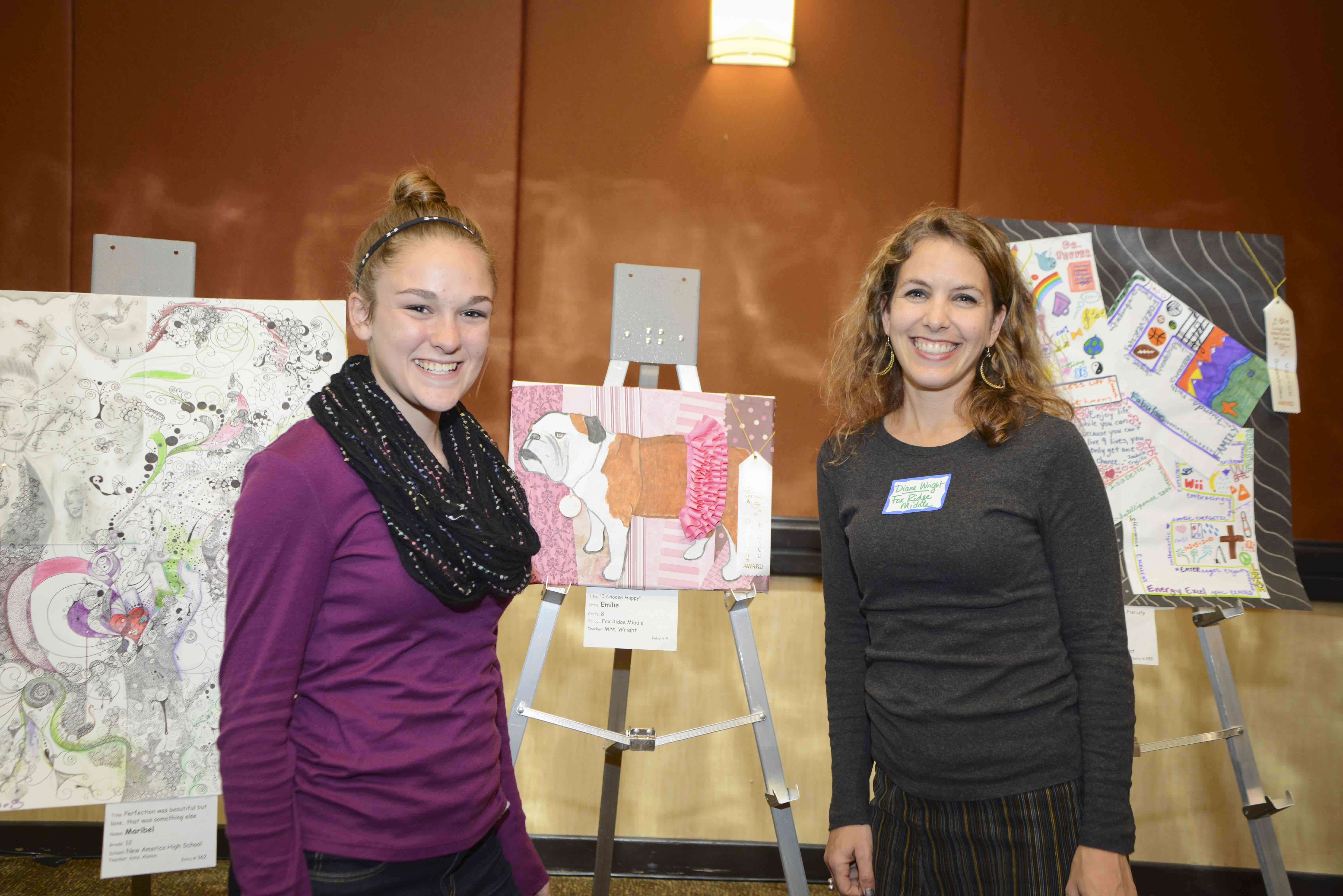 Student Emilie Filloon poses with her award-winning art and her teacher ...