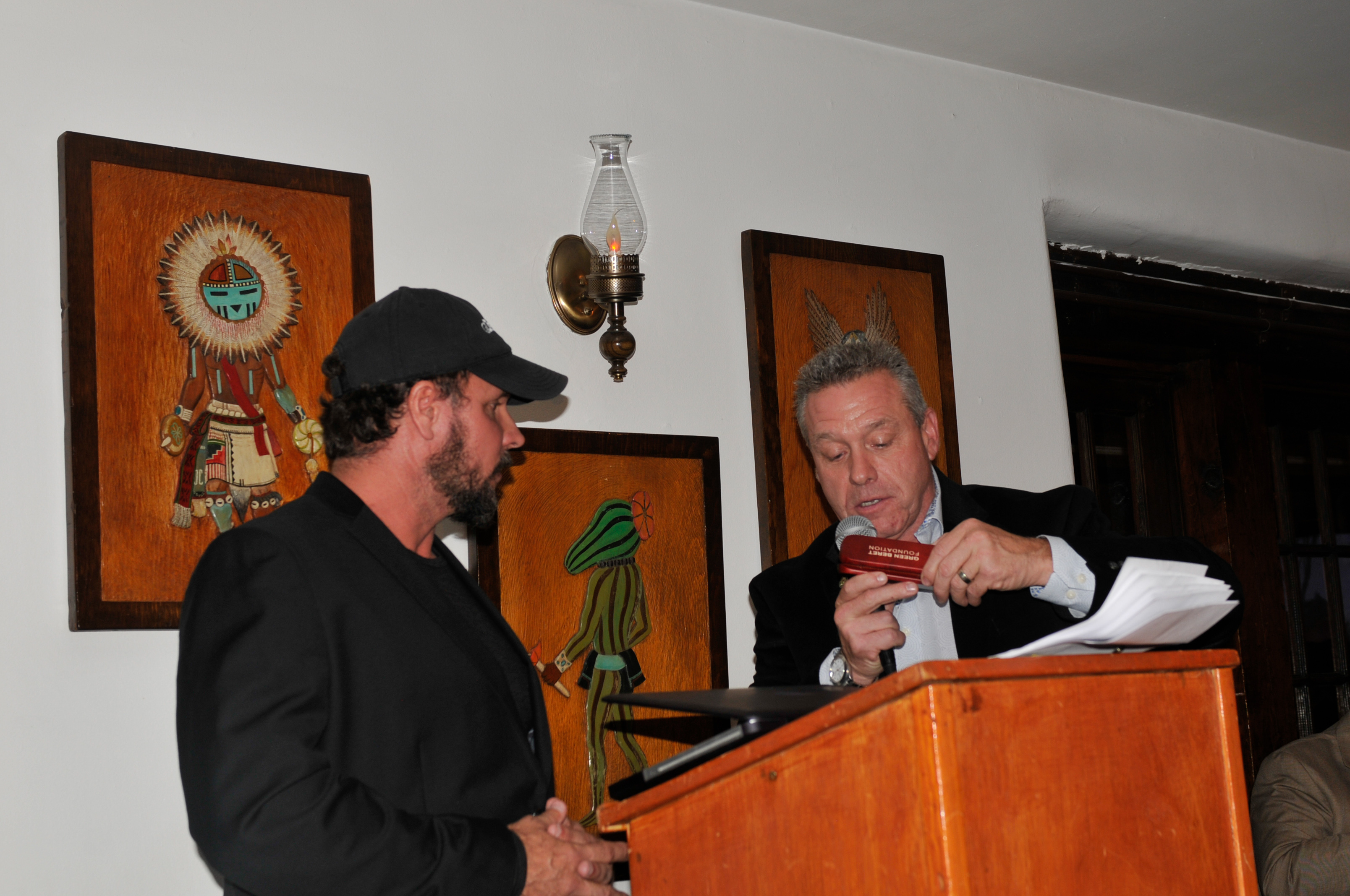 Joe Teti looks on as Bruce Parkman presents a token of appreciation