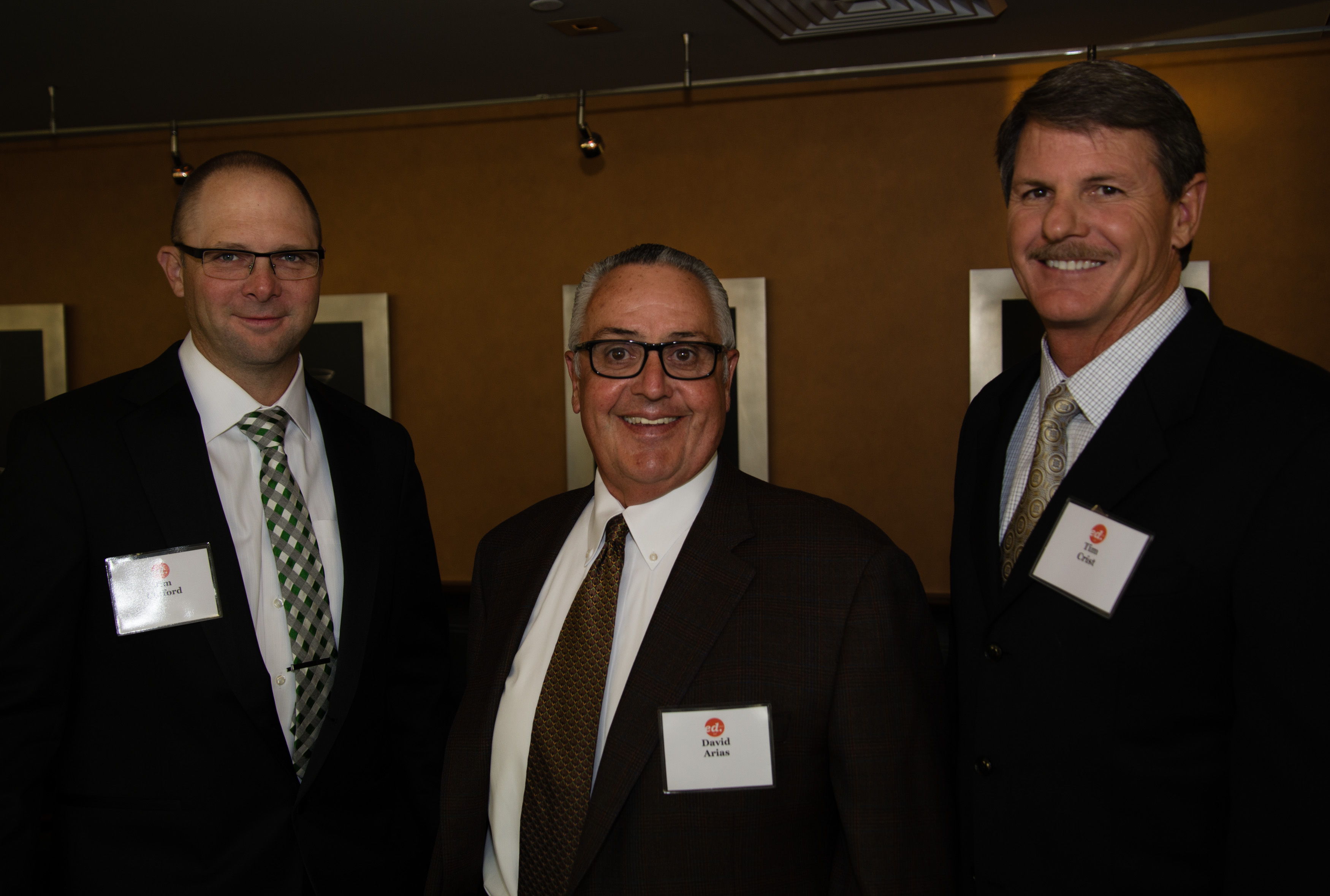 Jim Clifford, left, with David Arias and Tim Crist