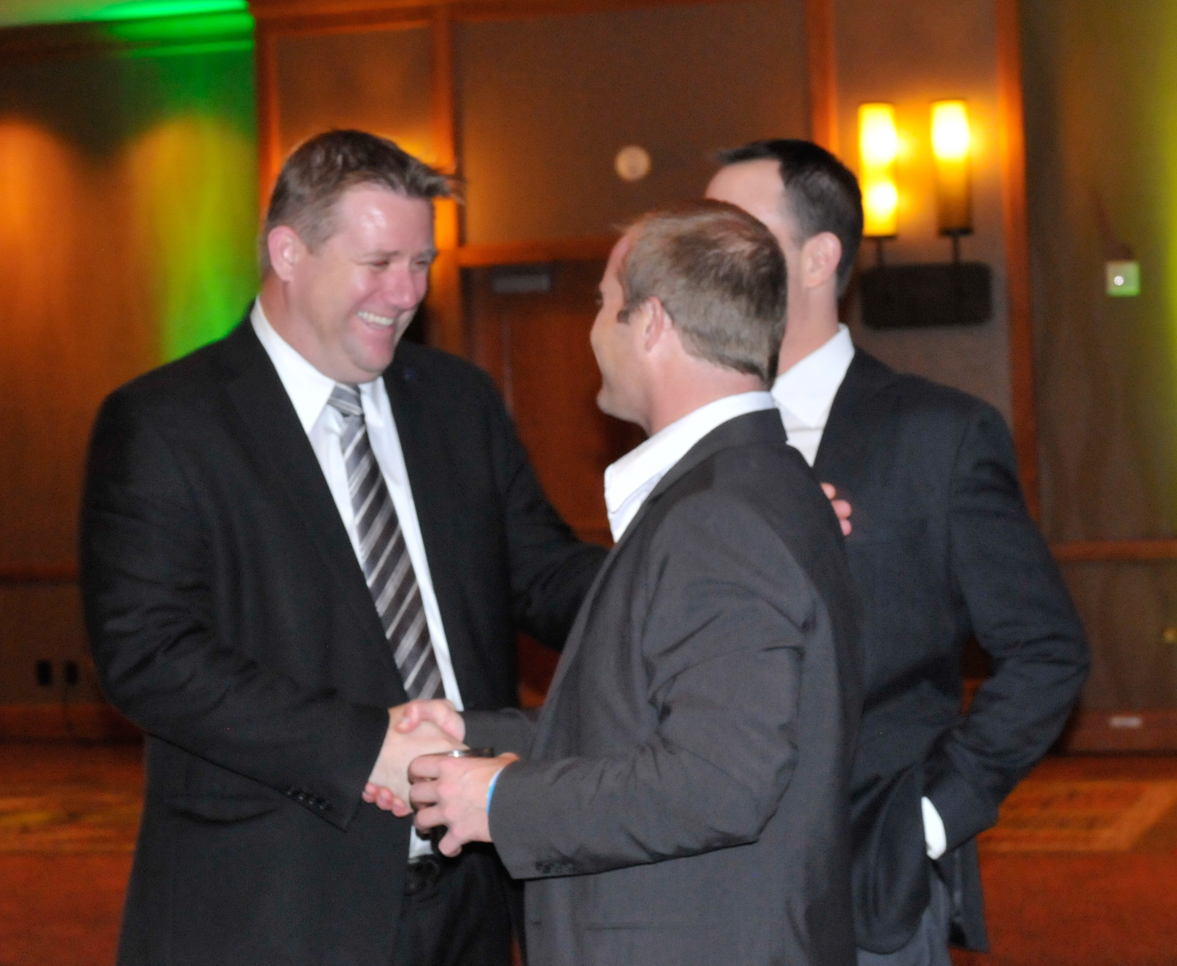The Sheraton's Brian Noel, left, greets guests