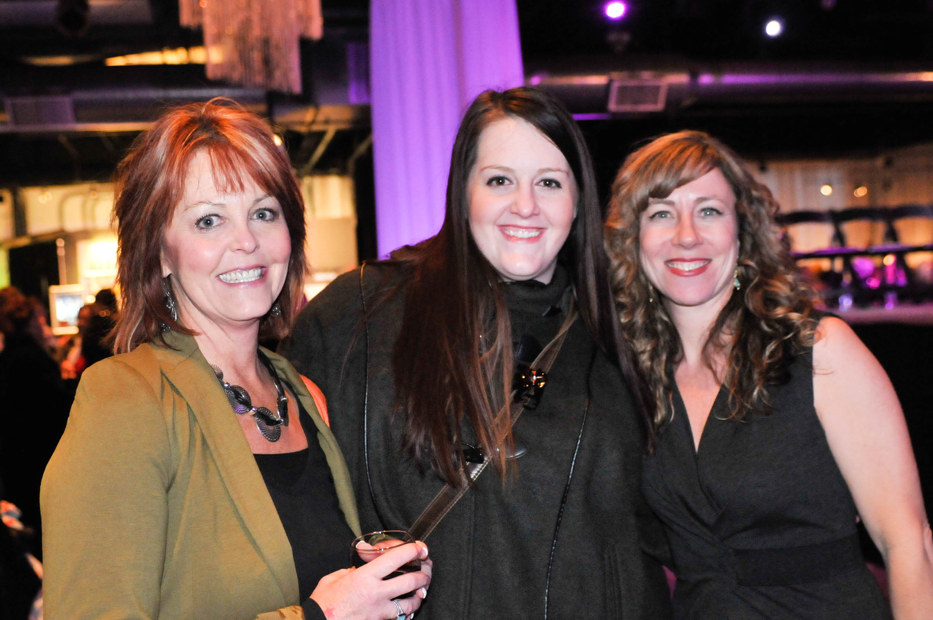 Deb Lloyd, left, Allison Lloyd and Goodwill's Kristen Blessman