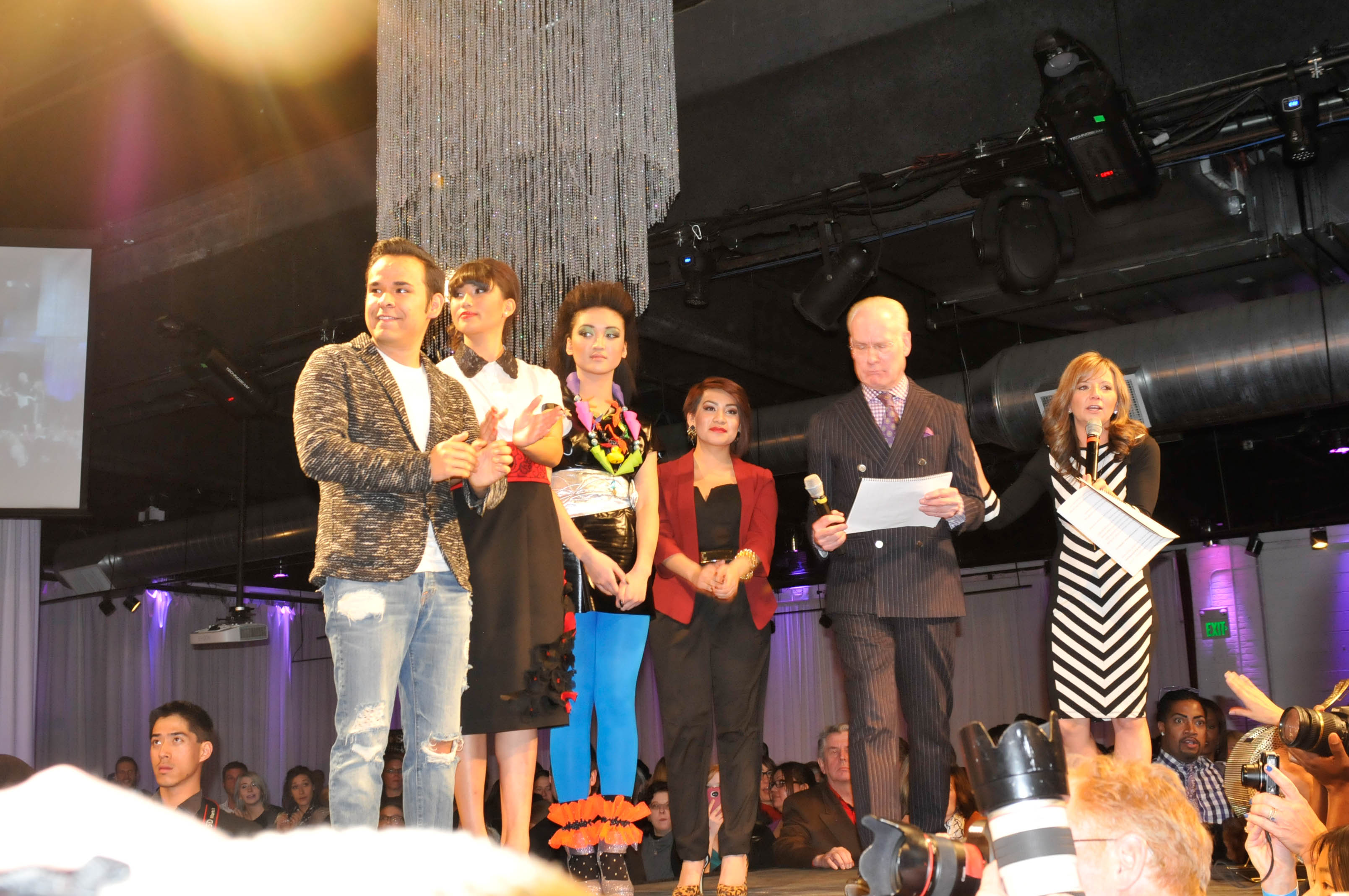 Award winners on stage with Tim Gunn and Lisa Hidalgo