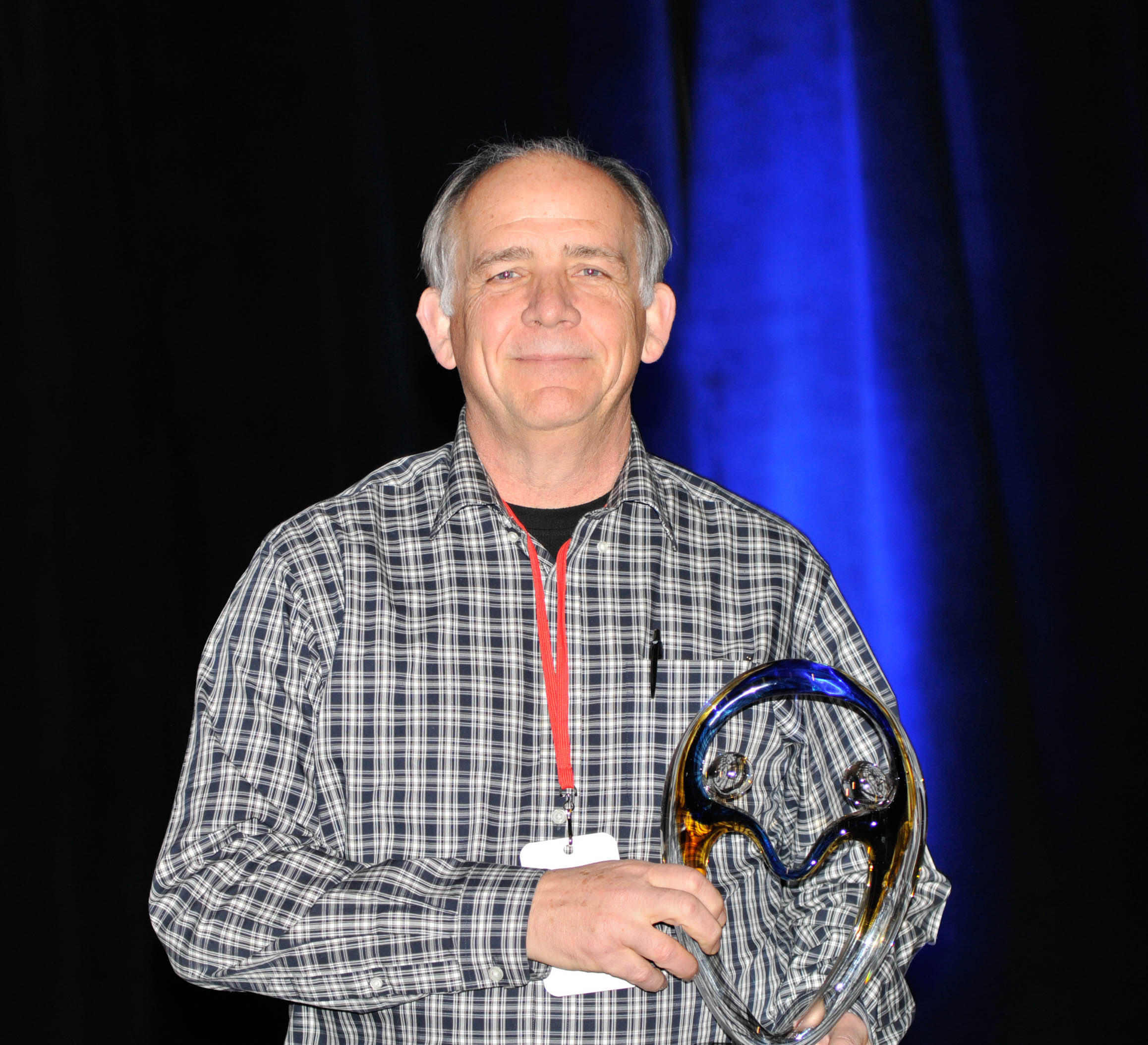 Pastor Russ Kane accepts the Philanthropic Organization award on behalf ...