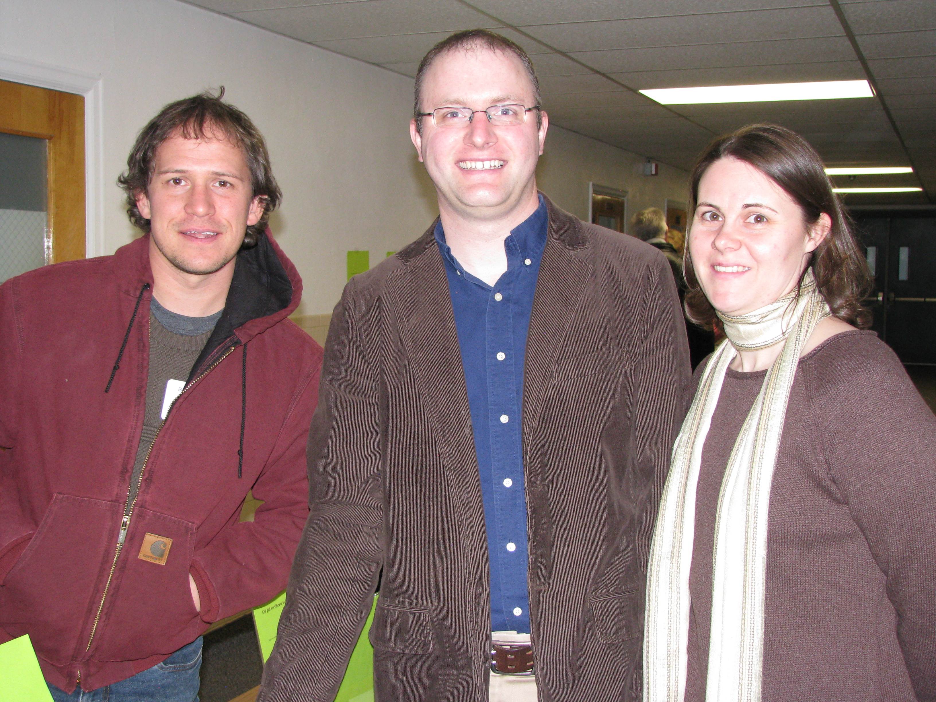 Brian Howard, left, catches up with Josh and Jenni Eno