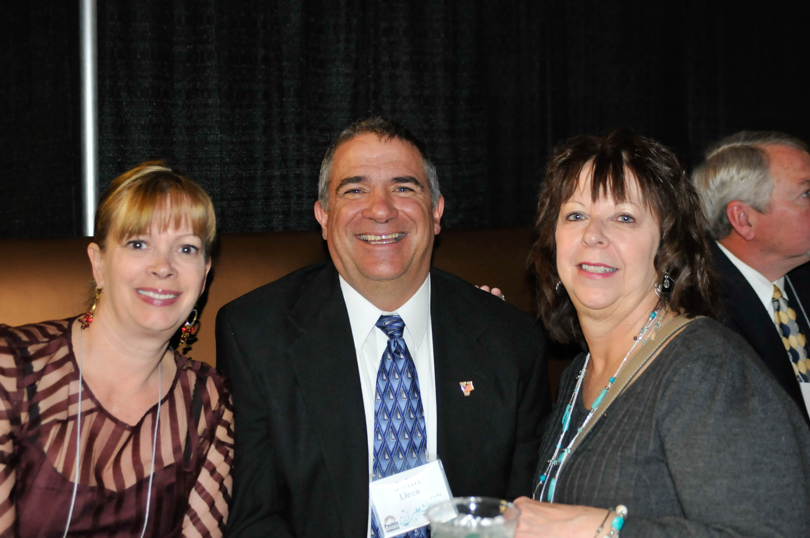 Black Hills Energy's Jill Linck, left, John Linck, and Becky Sudduth