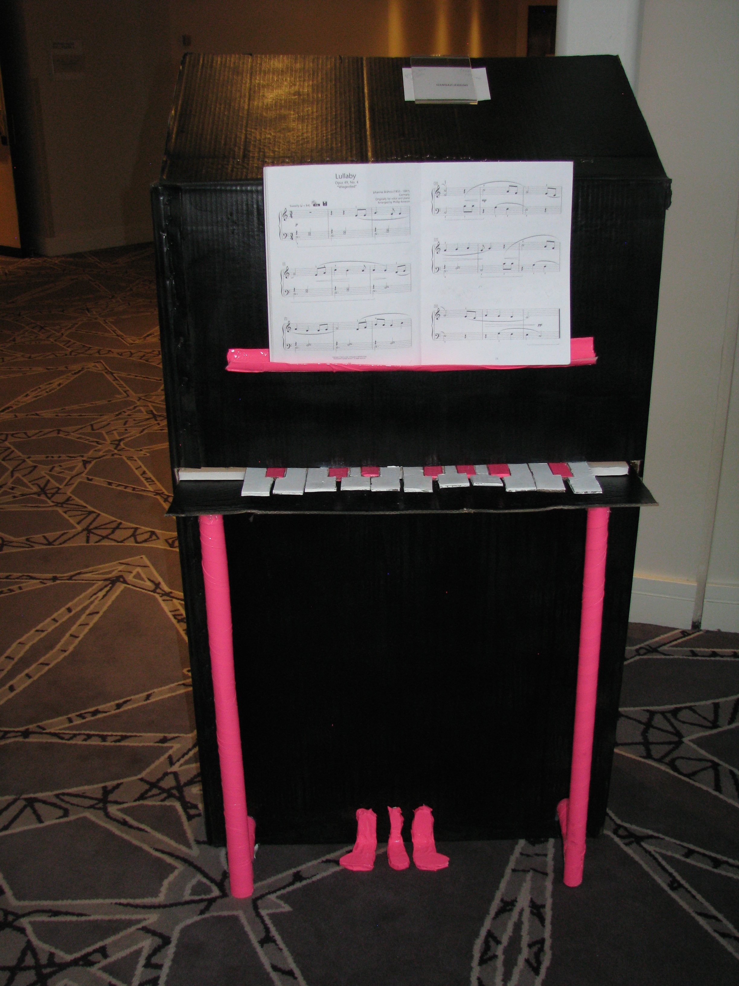 A playable piano carefully constructed from cardboard