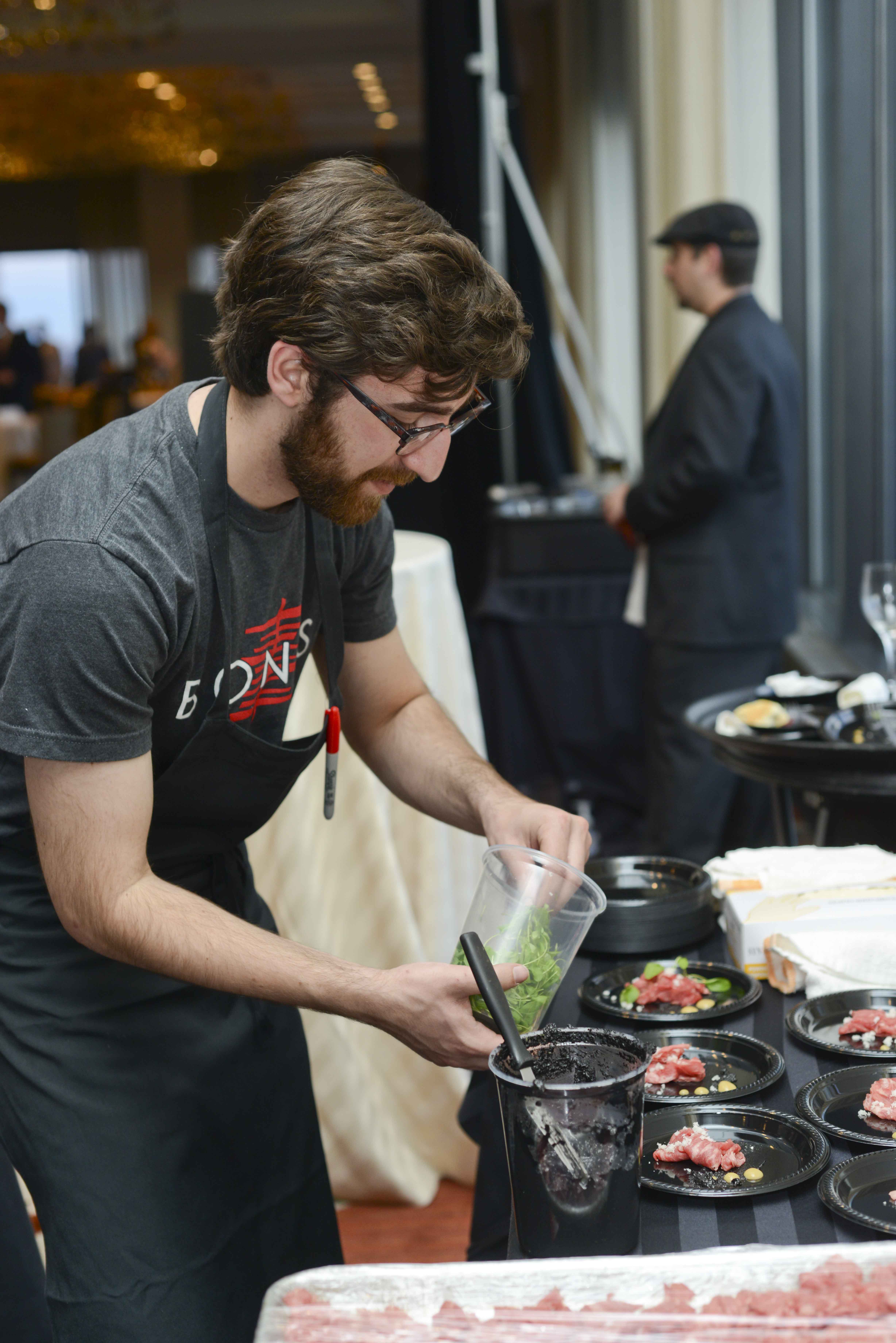 Nick Desario, from Bones, puts the finishing touches on the small plates