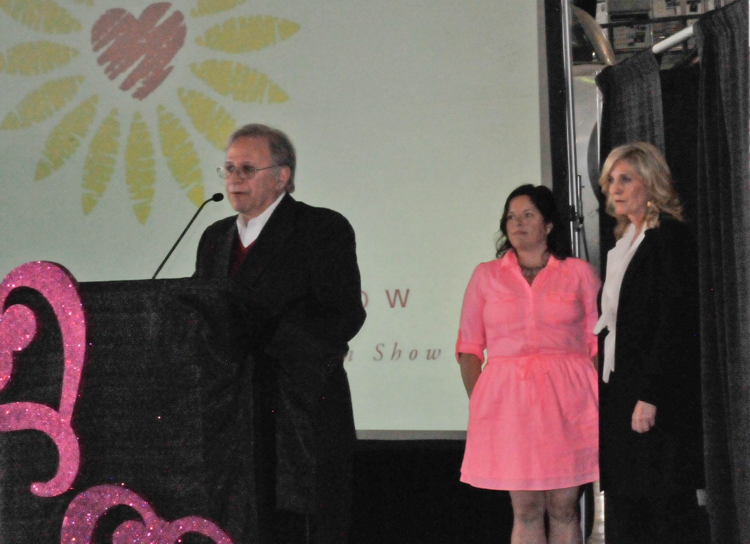 Dr. Michael Schaffer on stage with Lindsay Beliaeva and Cyd Rodriguez