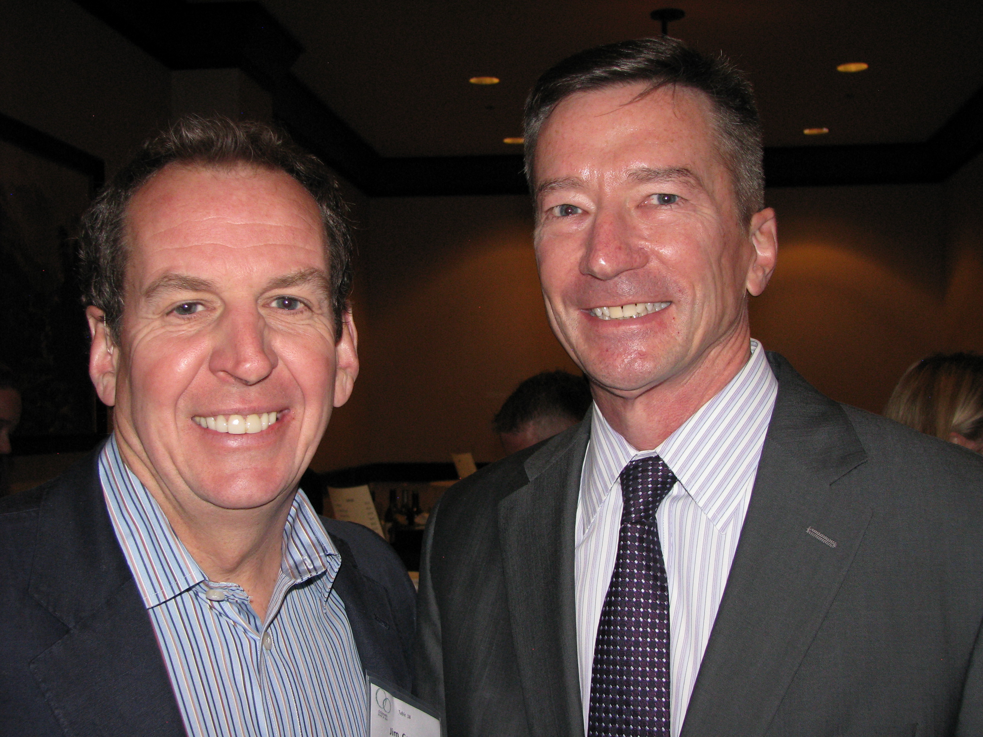 Jim Conley, left, catches up with CYAR board chair Dr. Vance Bray