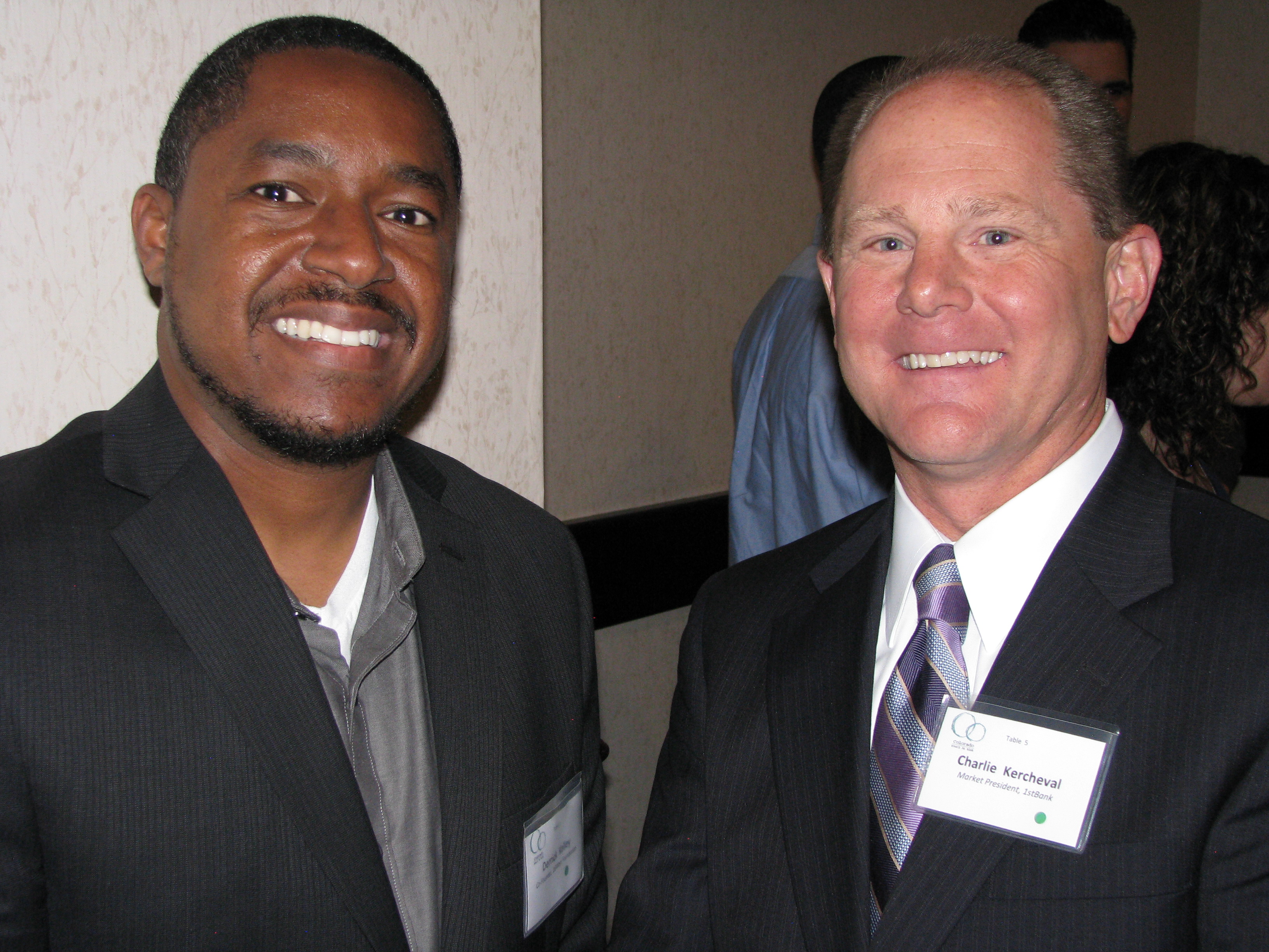 Derrick Kelley, left, talks with Charlie Kercheval before the luncheon