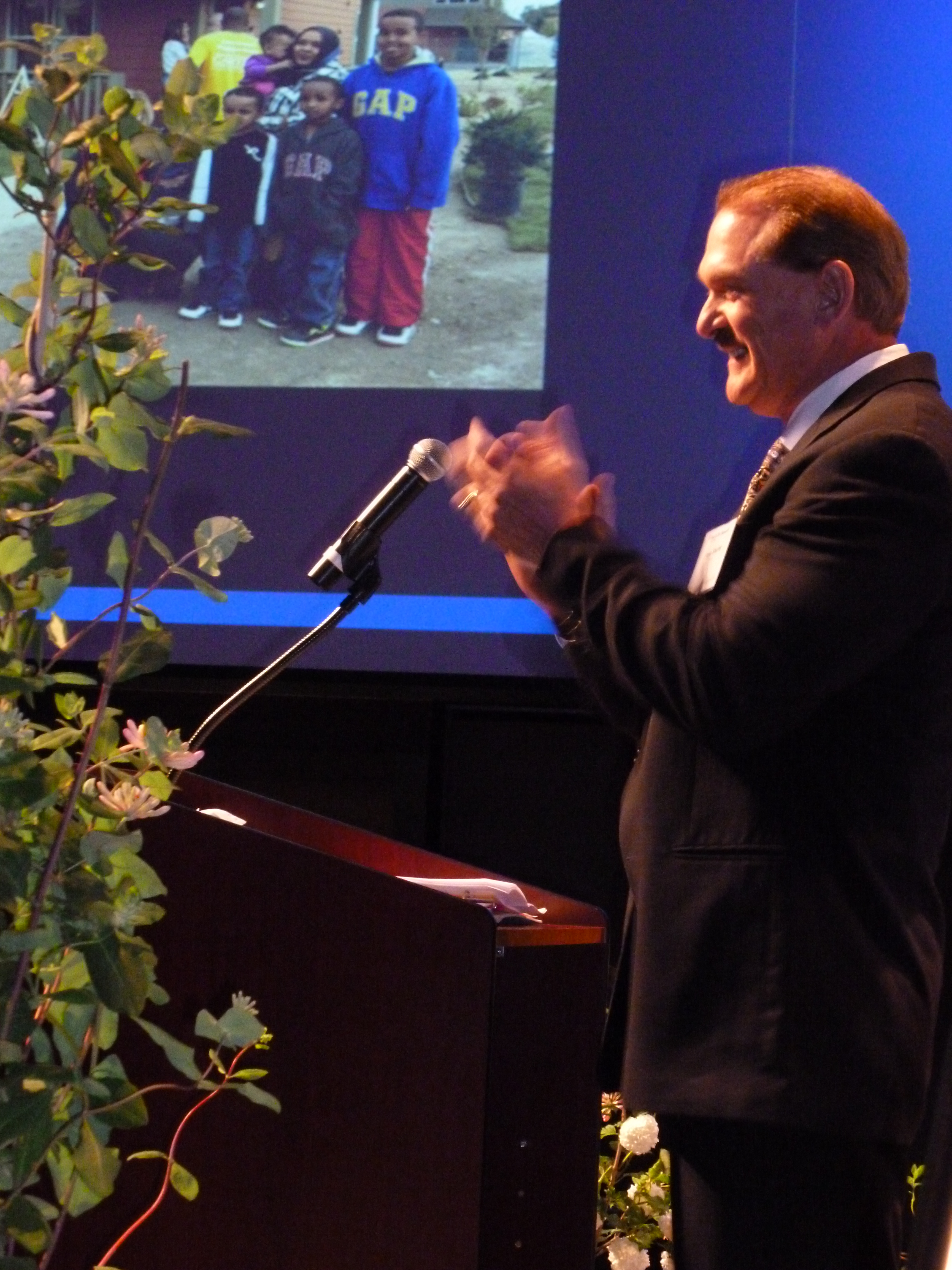 Board VP Steve Shaffer urges the crowd to "help build it" with donations.