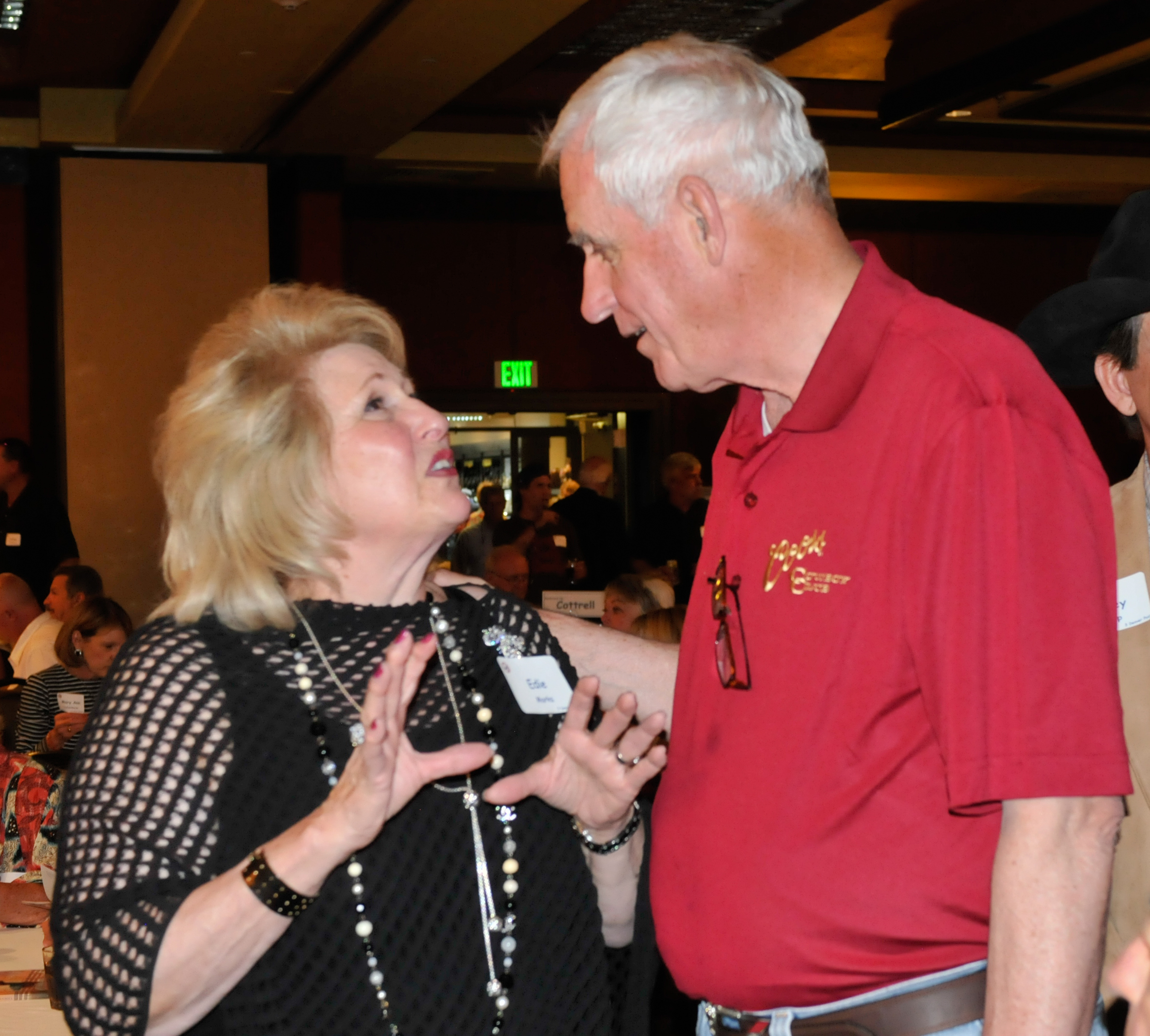 Edie Marks makes a point to Pete Coors