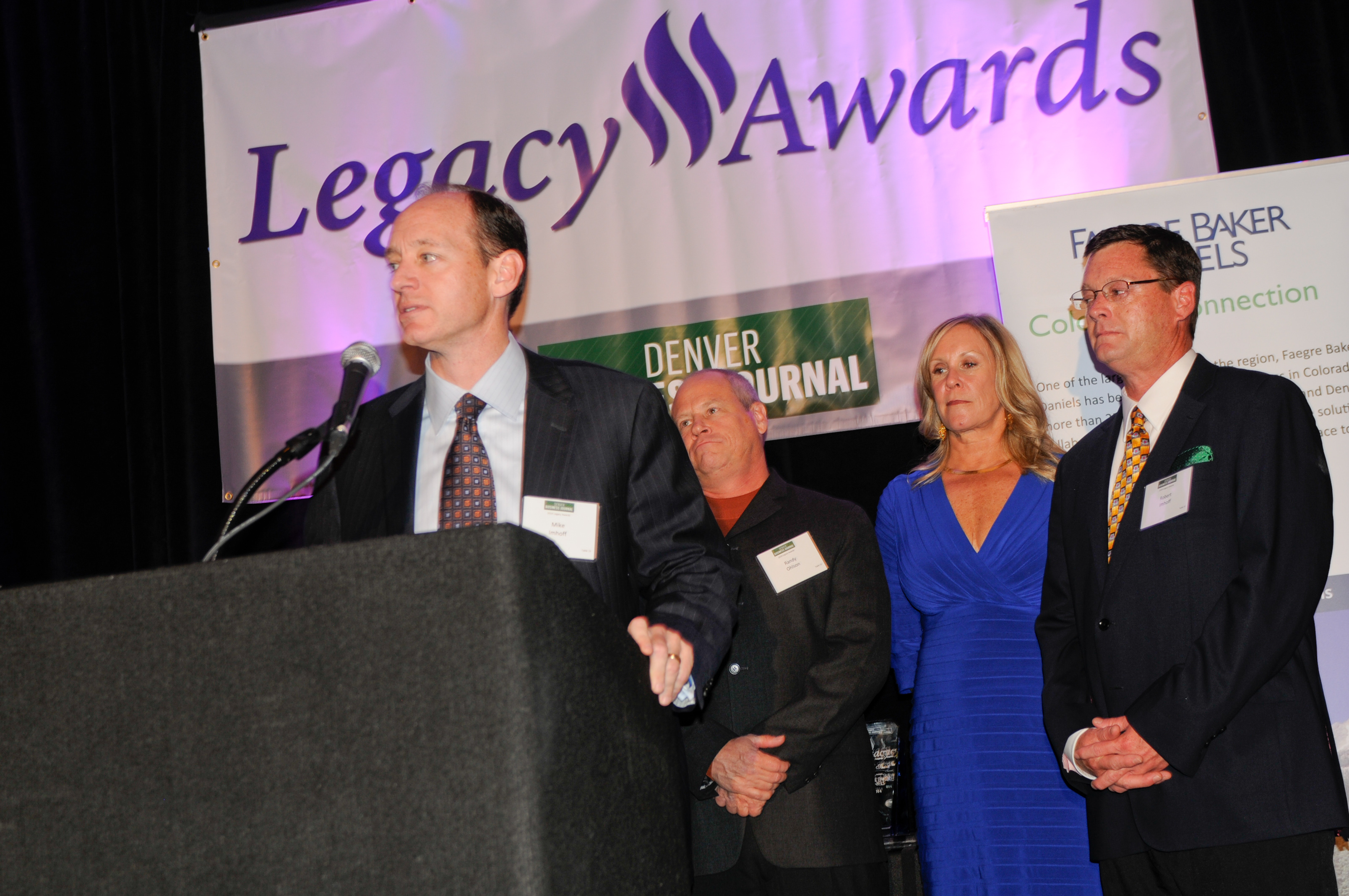 Mike Imhoff says a few words as Randy Ohlson, Stacy Ohlsson and Robert ...