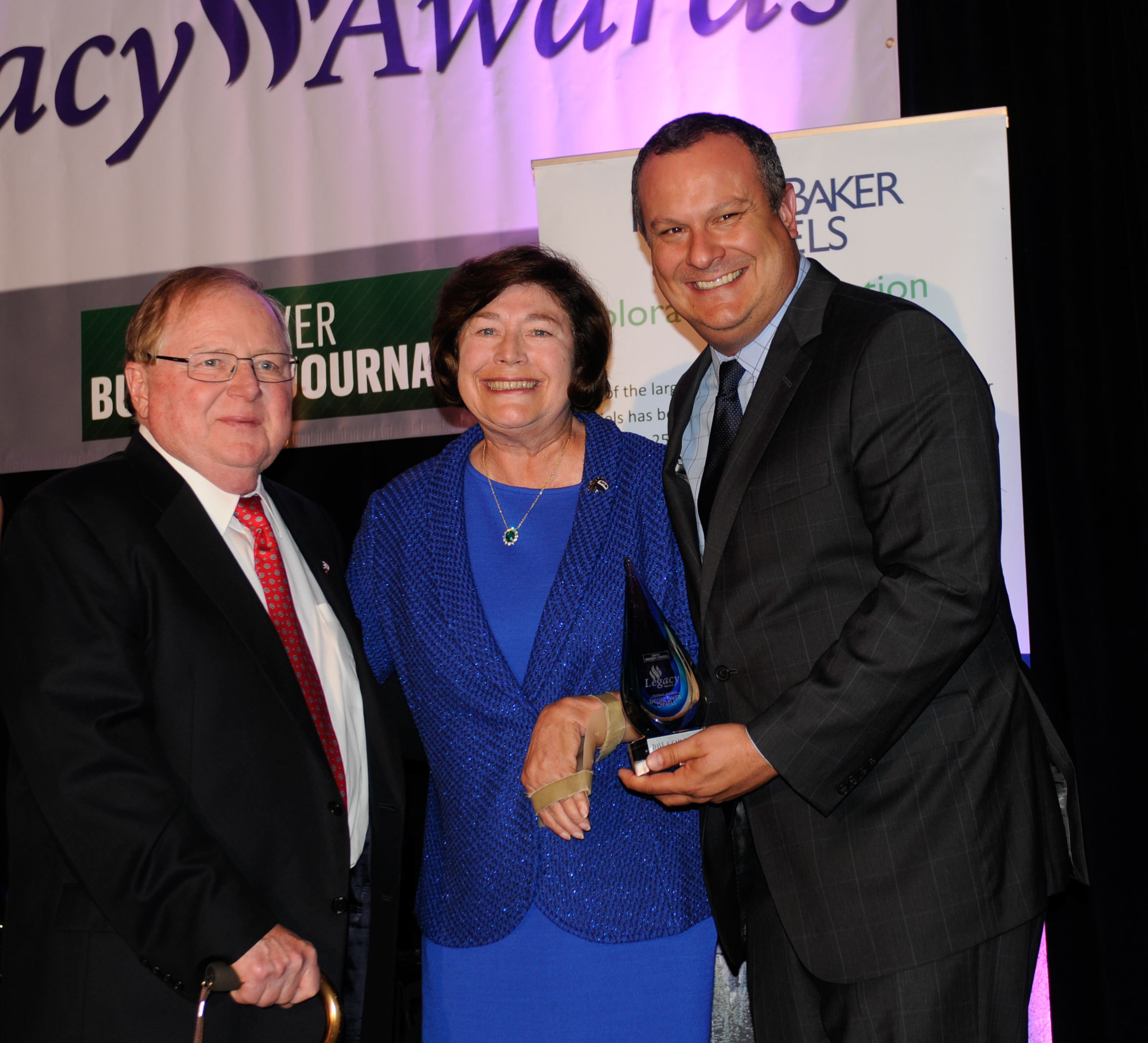 Dave and Gail Liniger accept their award from Pete Casillas, right