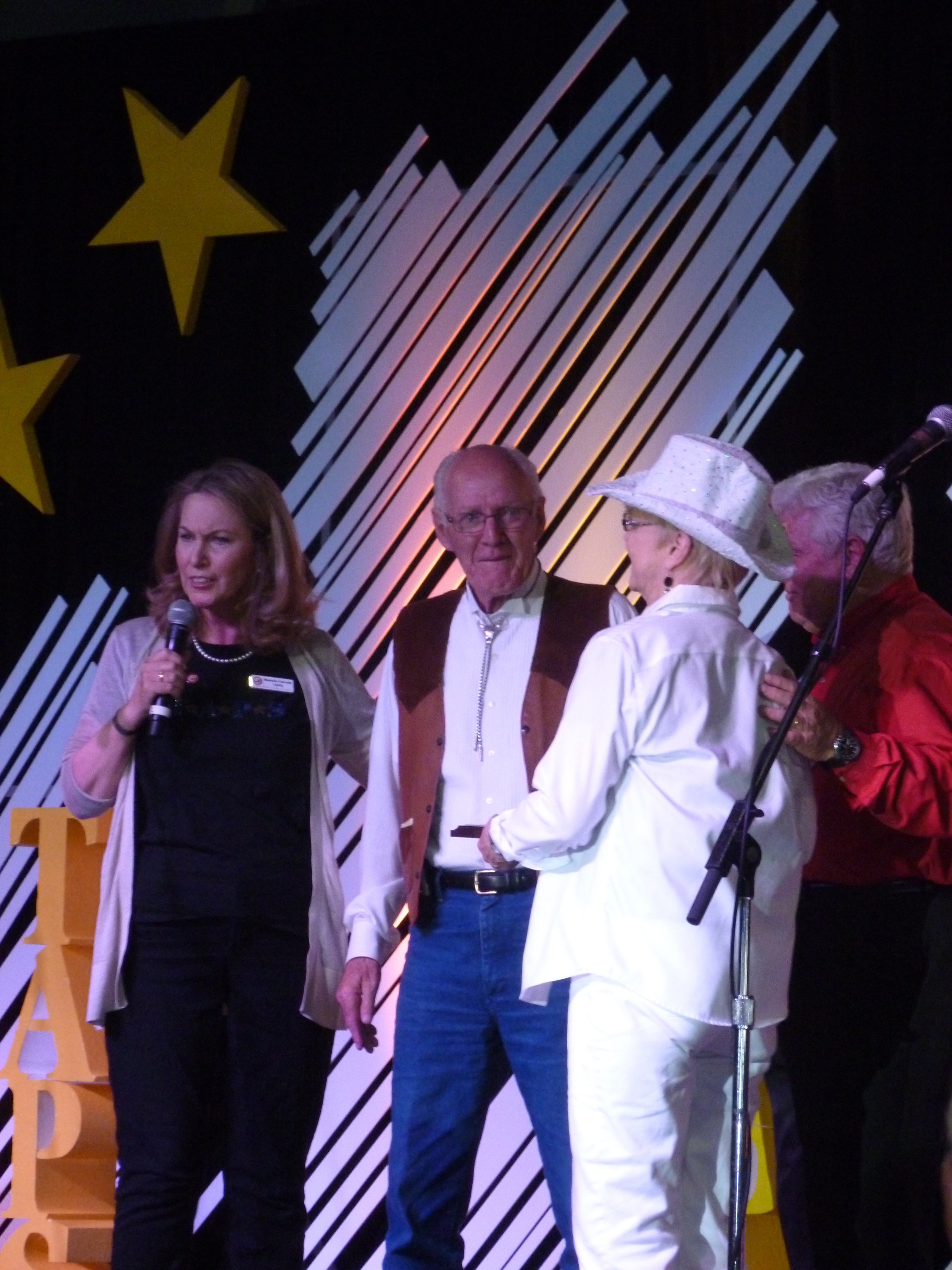 Bonnie Carroll (left) and Ron Spratt of TAPS (in red) award Bo and ...