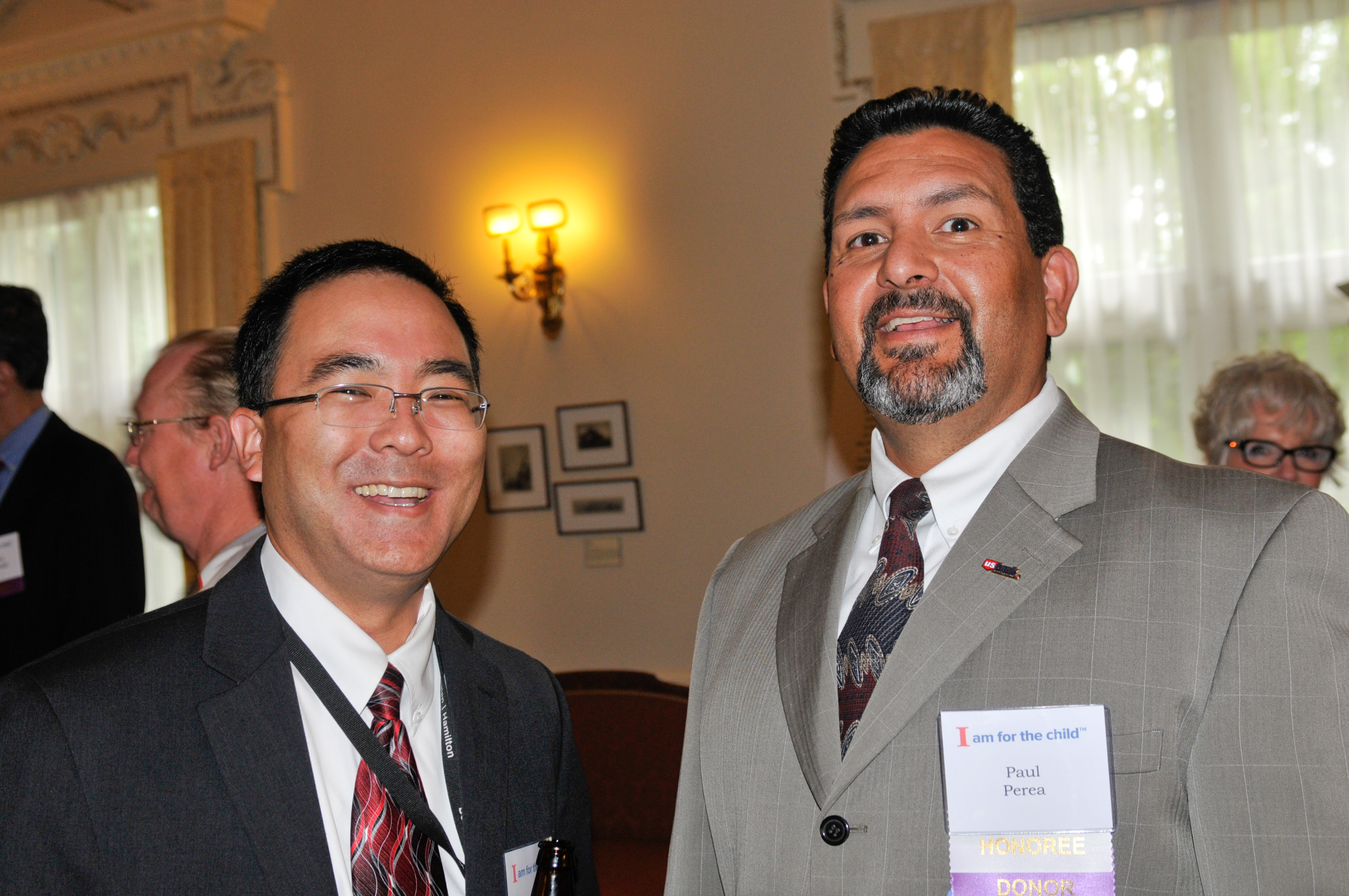 Board member Aje Sakamoto, left, and board member and honoree Paul Perea
