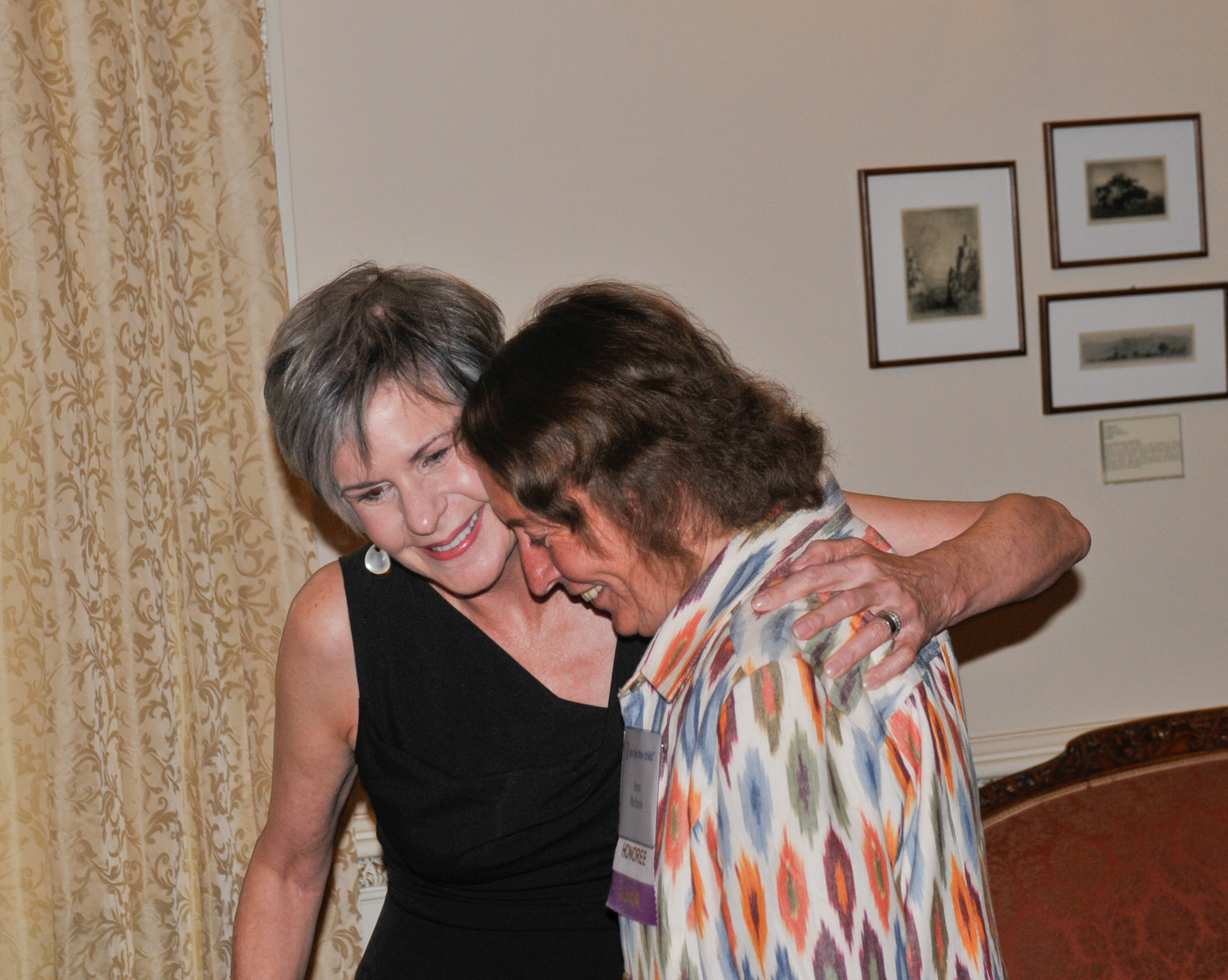 Trudy Strewler Hodges hugs honoree Ann Nichols