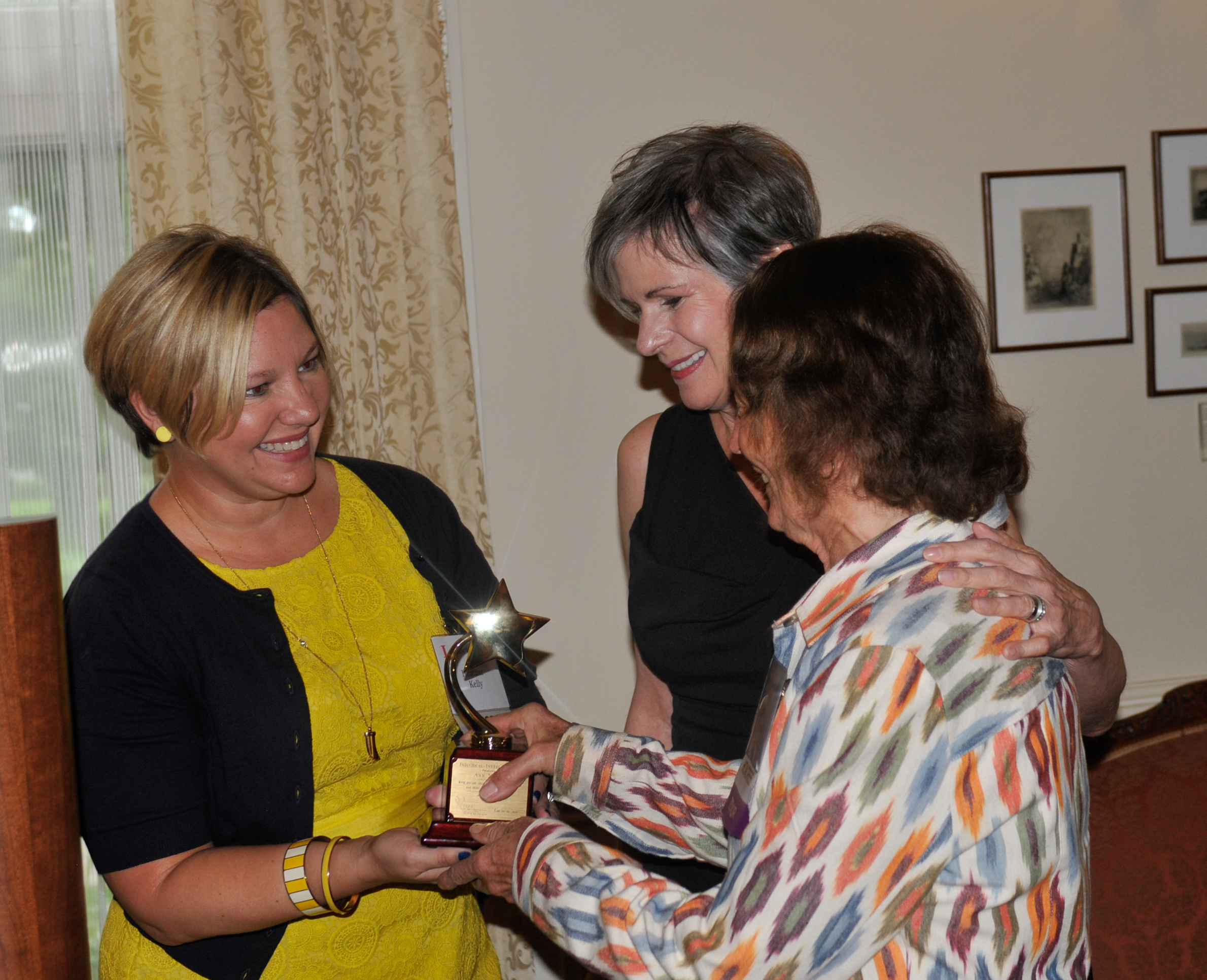 Heather Kelly, left, Trudy Strewler Hodges and honoree Ann Nichols
