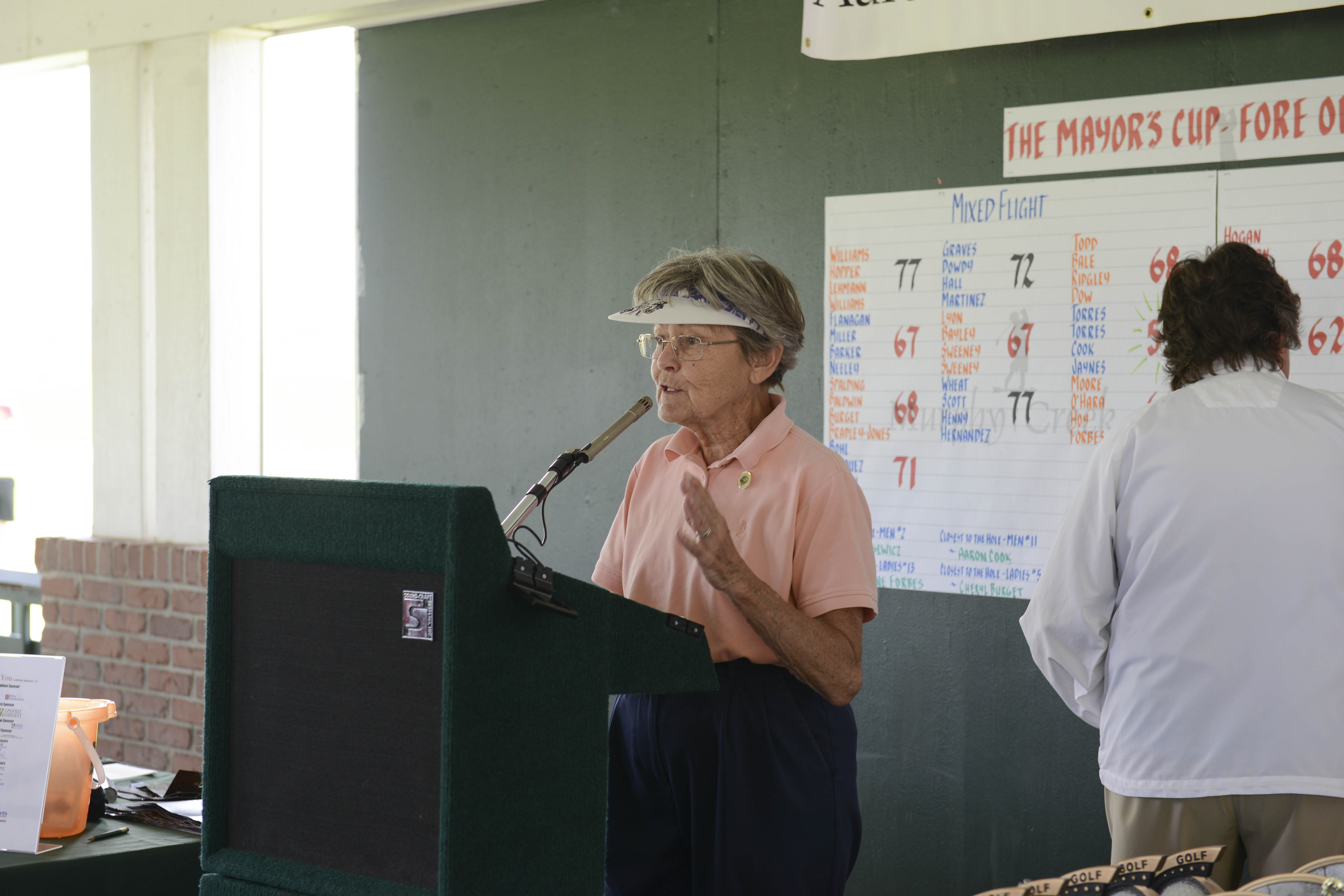 Board President Sandy Sweeney welcomes the crowd