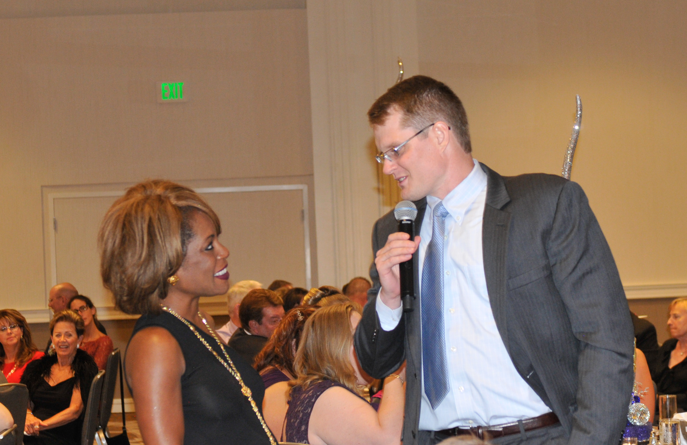 Ericka Lewis listens as Dr. Brian Daines talks about one of the missions