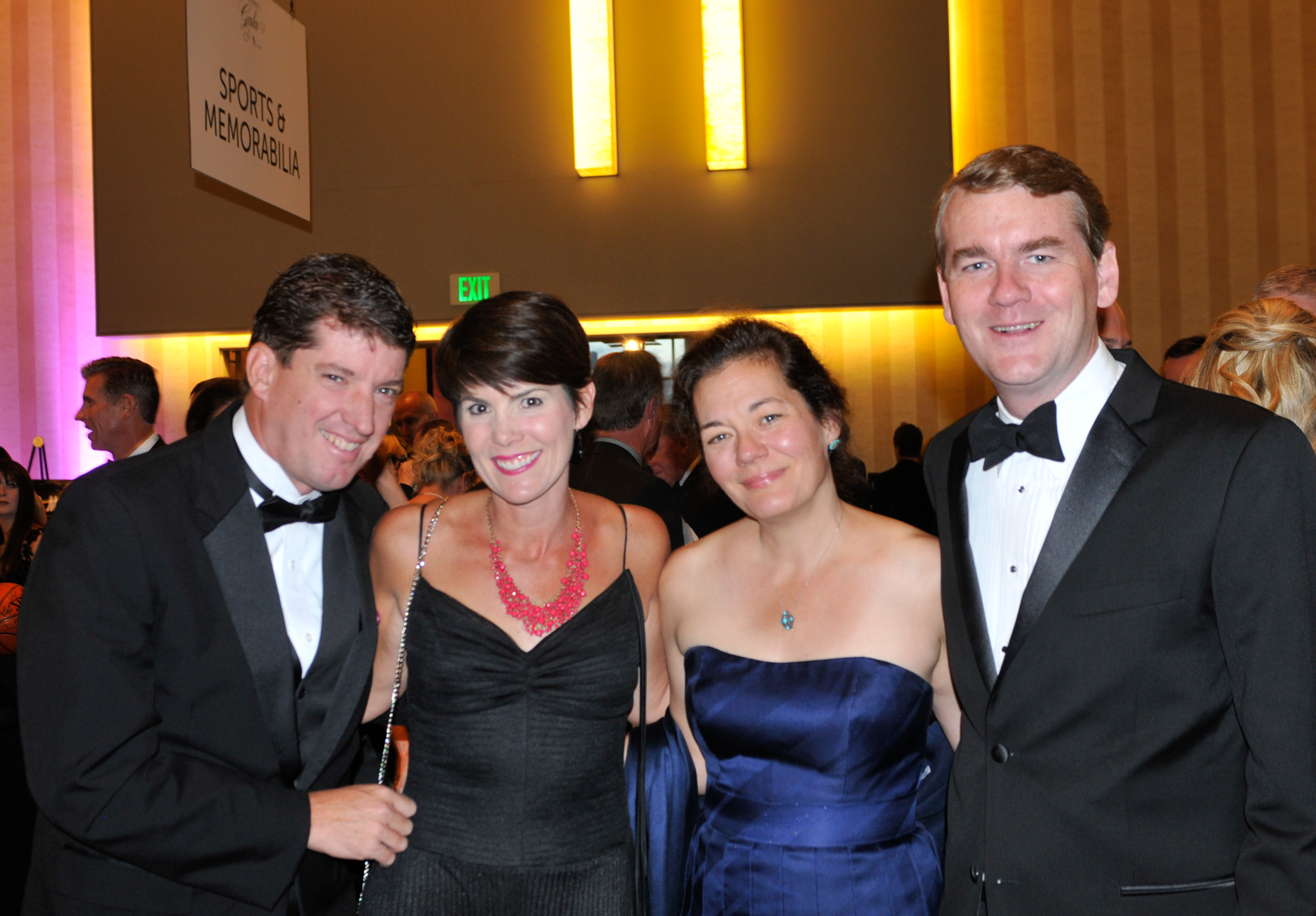 Chris West, left, Kyle Dyer, Susan Daggett and Senator Michael Bennet