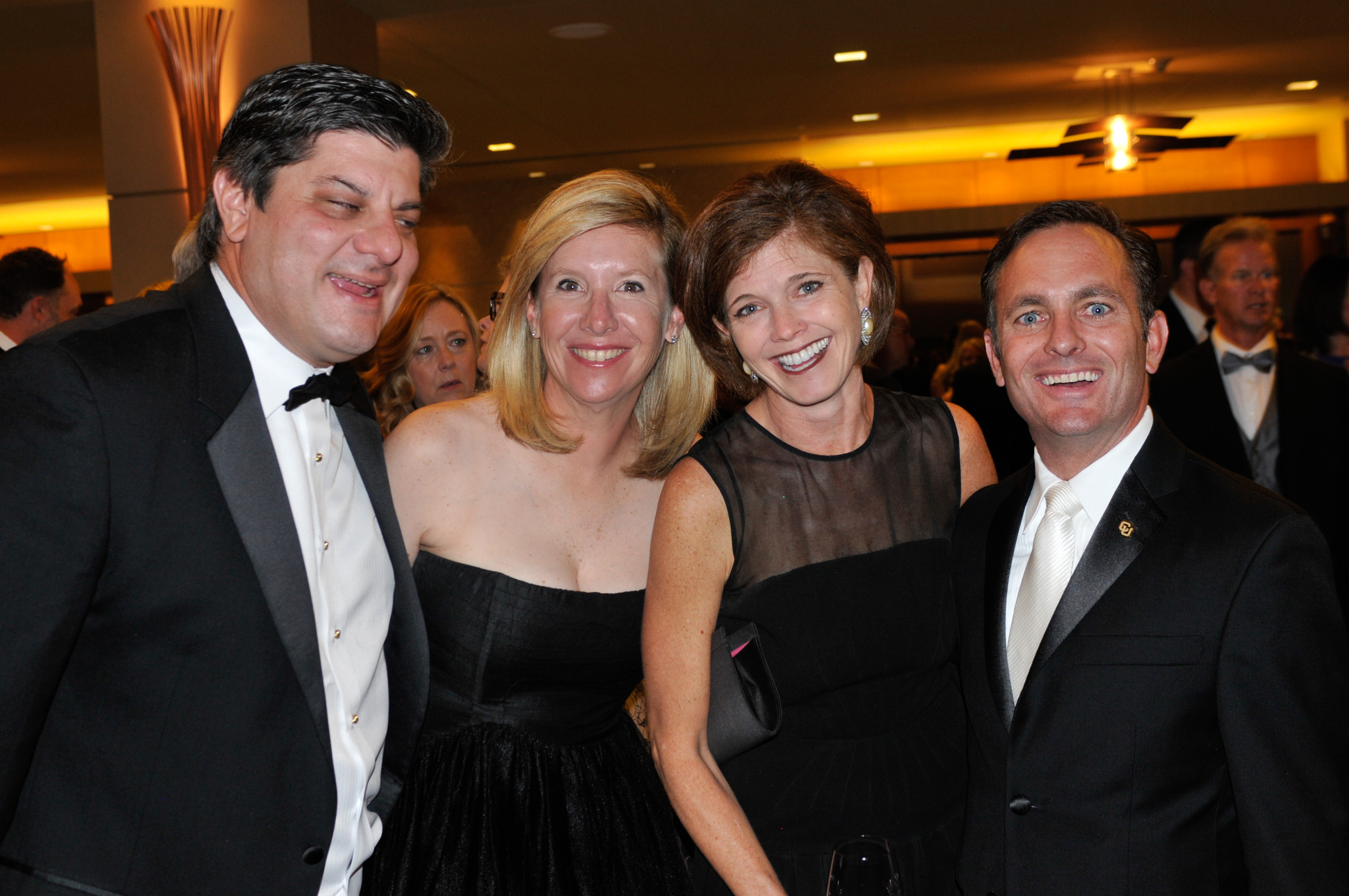 Nate and Carrie Trookman, left, Sally Hybl (board) and Kyle Hybl