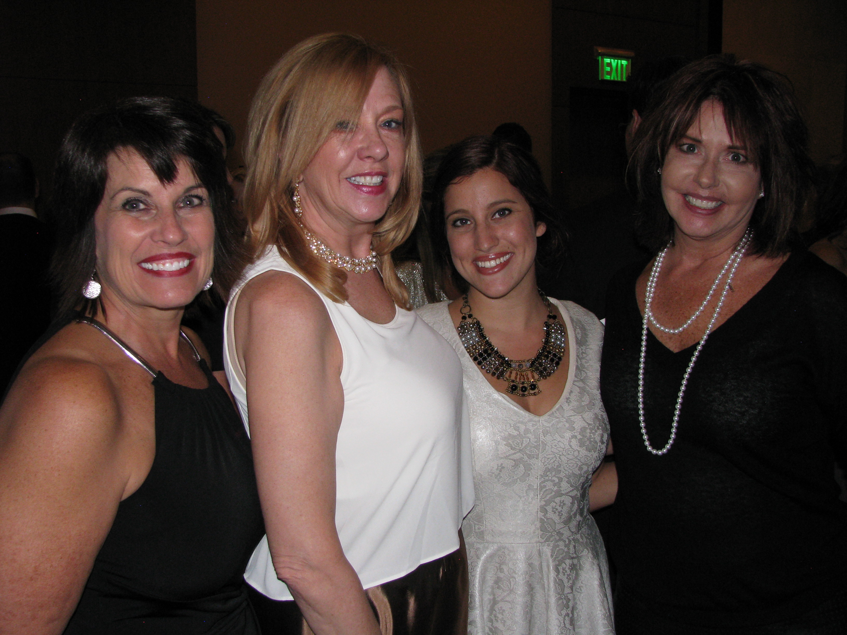 A quiet moment before the auction for Julie Collett, left, Shelly St ...