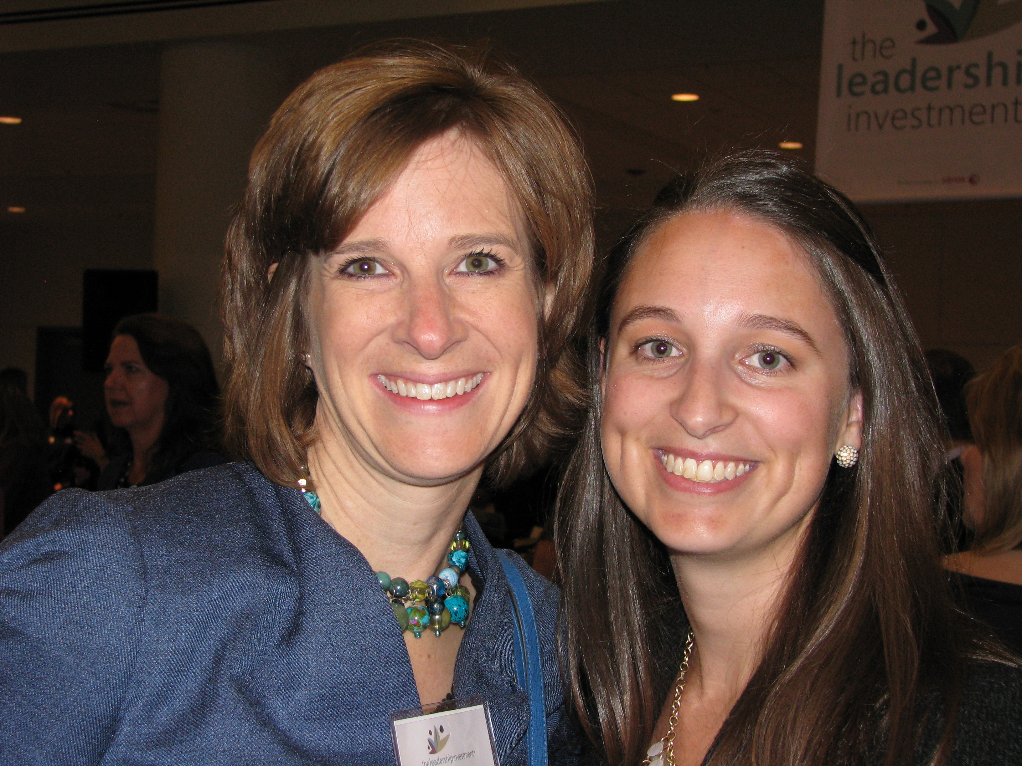 Meg Rau, left, and Kelly Fullerton smile at the success of the event