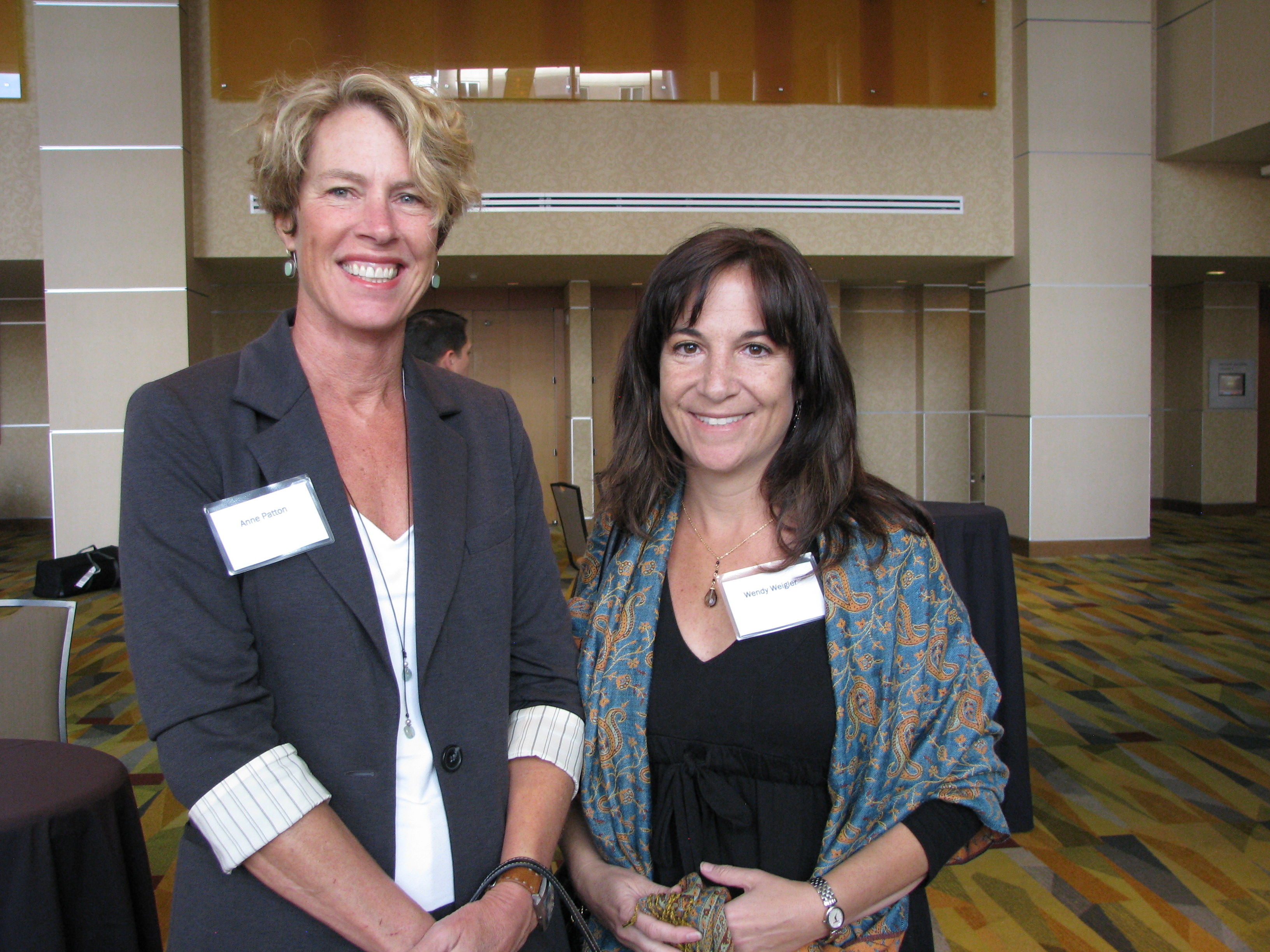 Anne Patton, left, catches up with Wendy Weigler