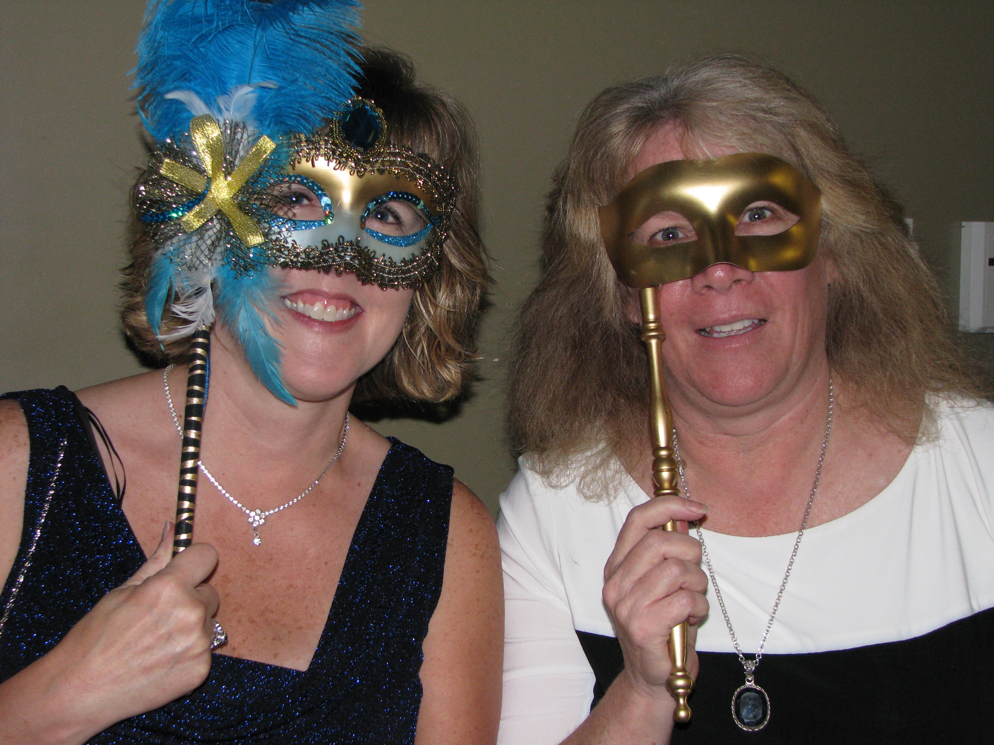 Susan Fallander, left, and Connie Nelson show off their masks