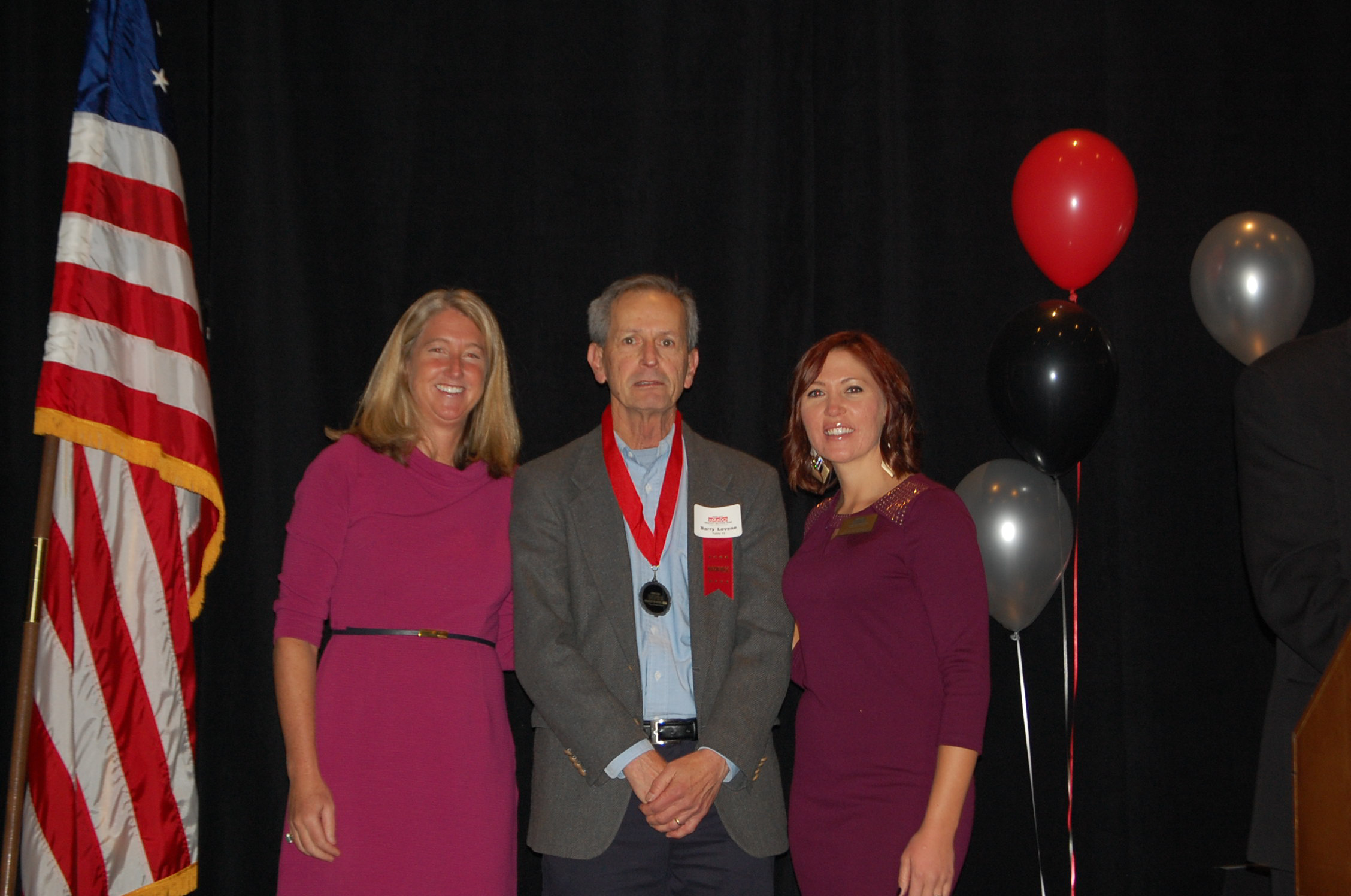 Cary Kennedy and Jaclyn Wilmot with October honoree Barry Levene