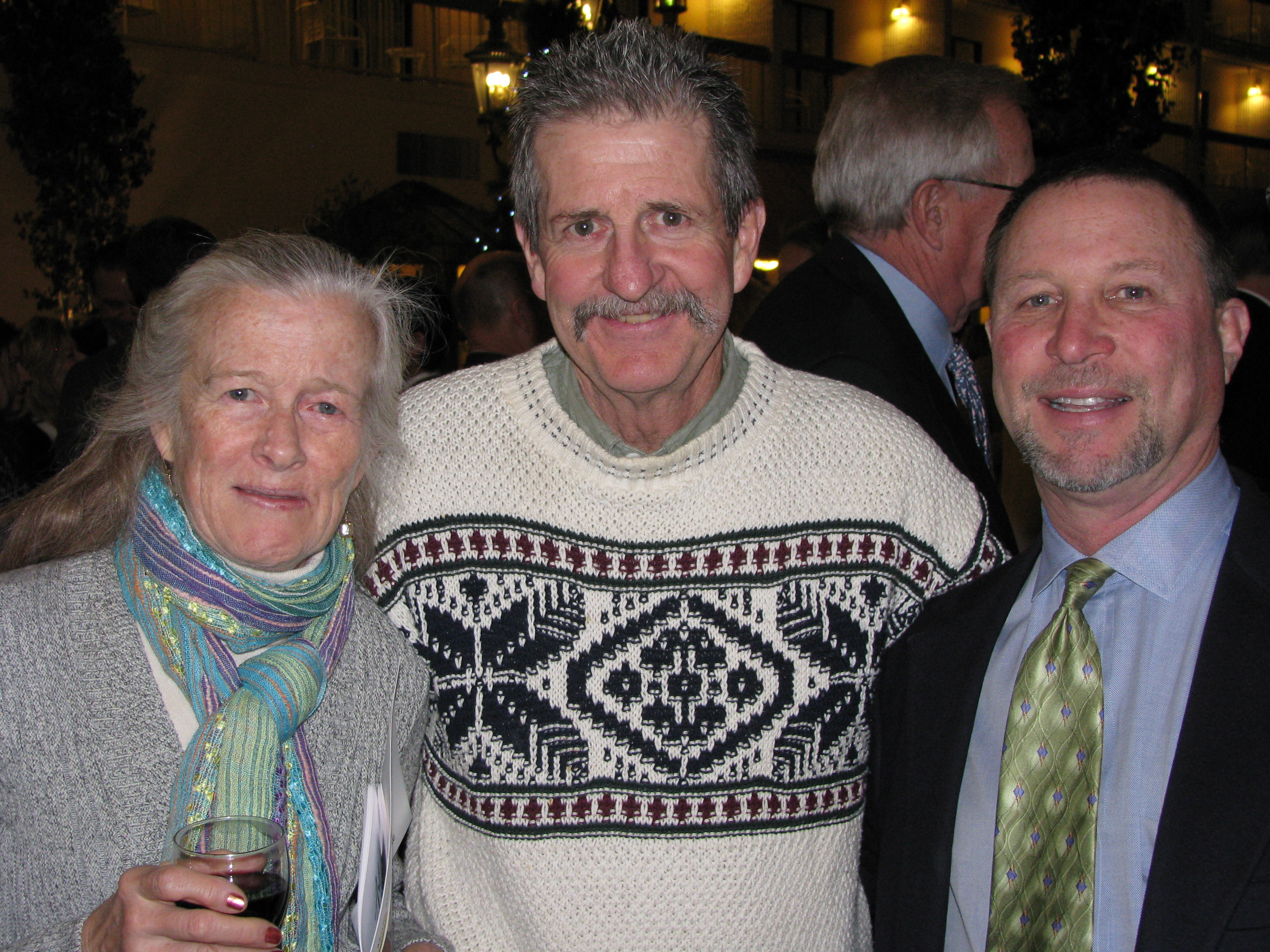 Diana and Mark Moyle smile with Randy Stein