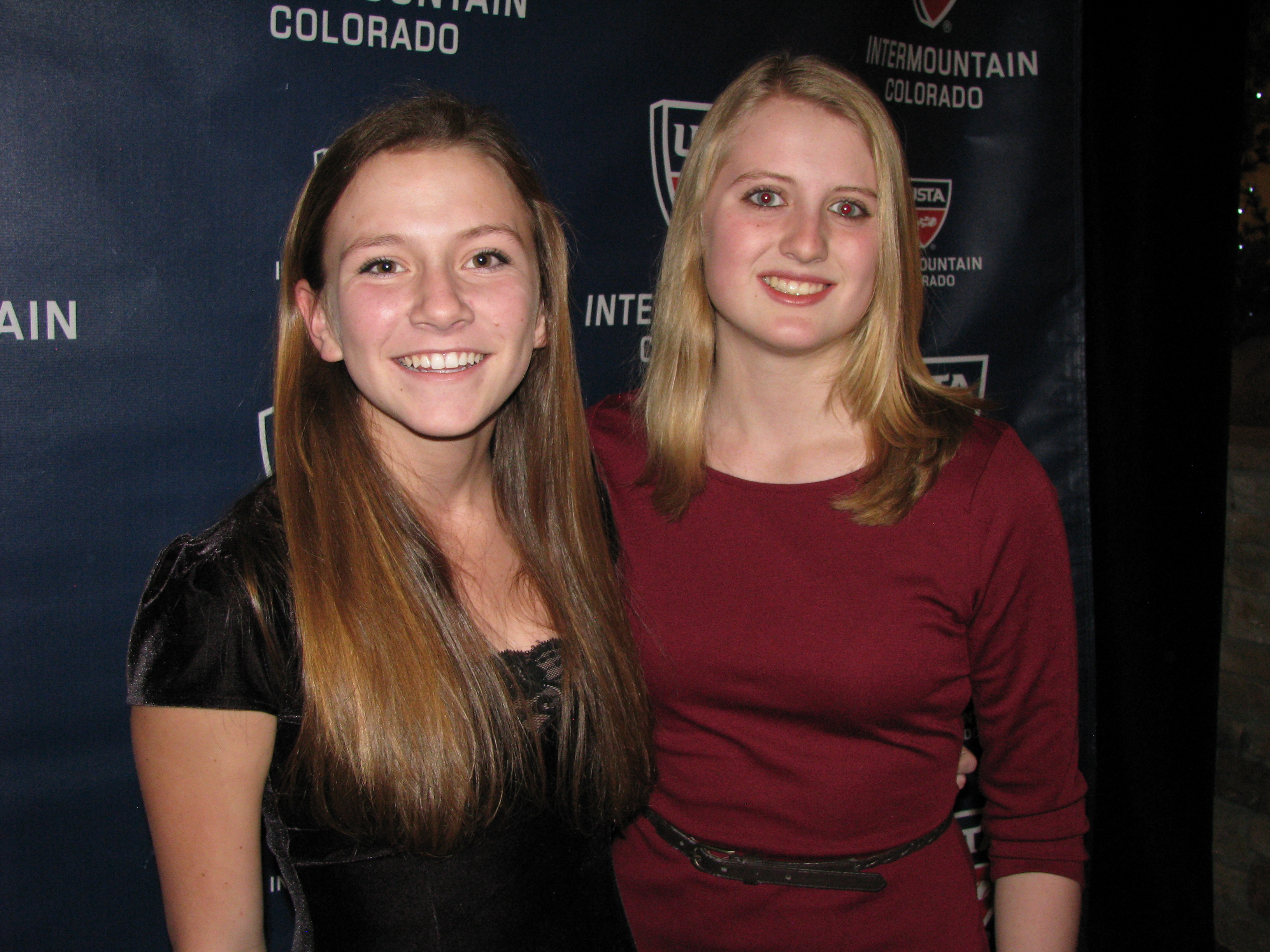 Ally Arenson, left, and Tory Louis are proud of the award for their team