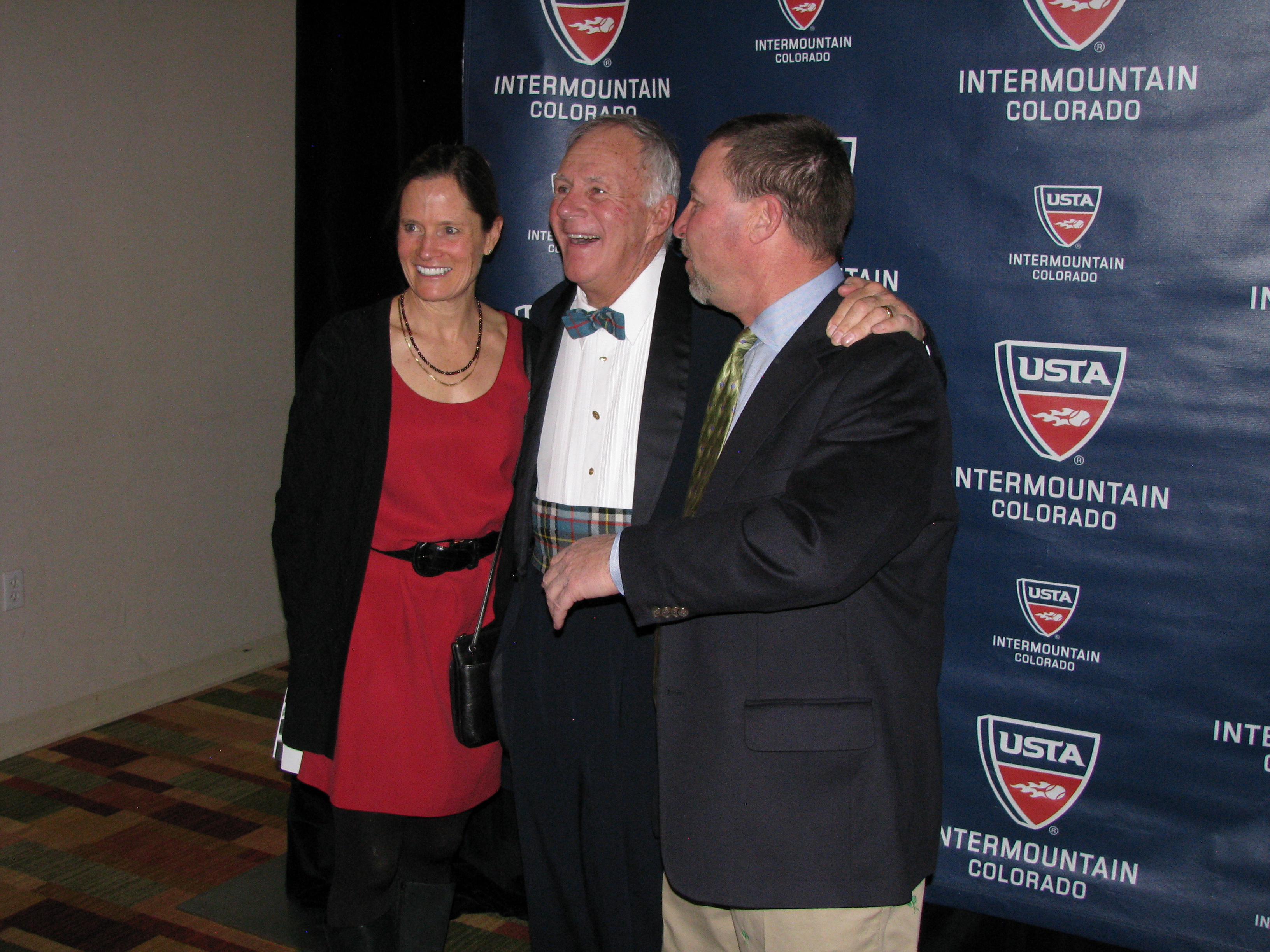 Big smiles from Karen Sather, left, and honoree Art Thomson, center