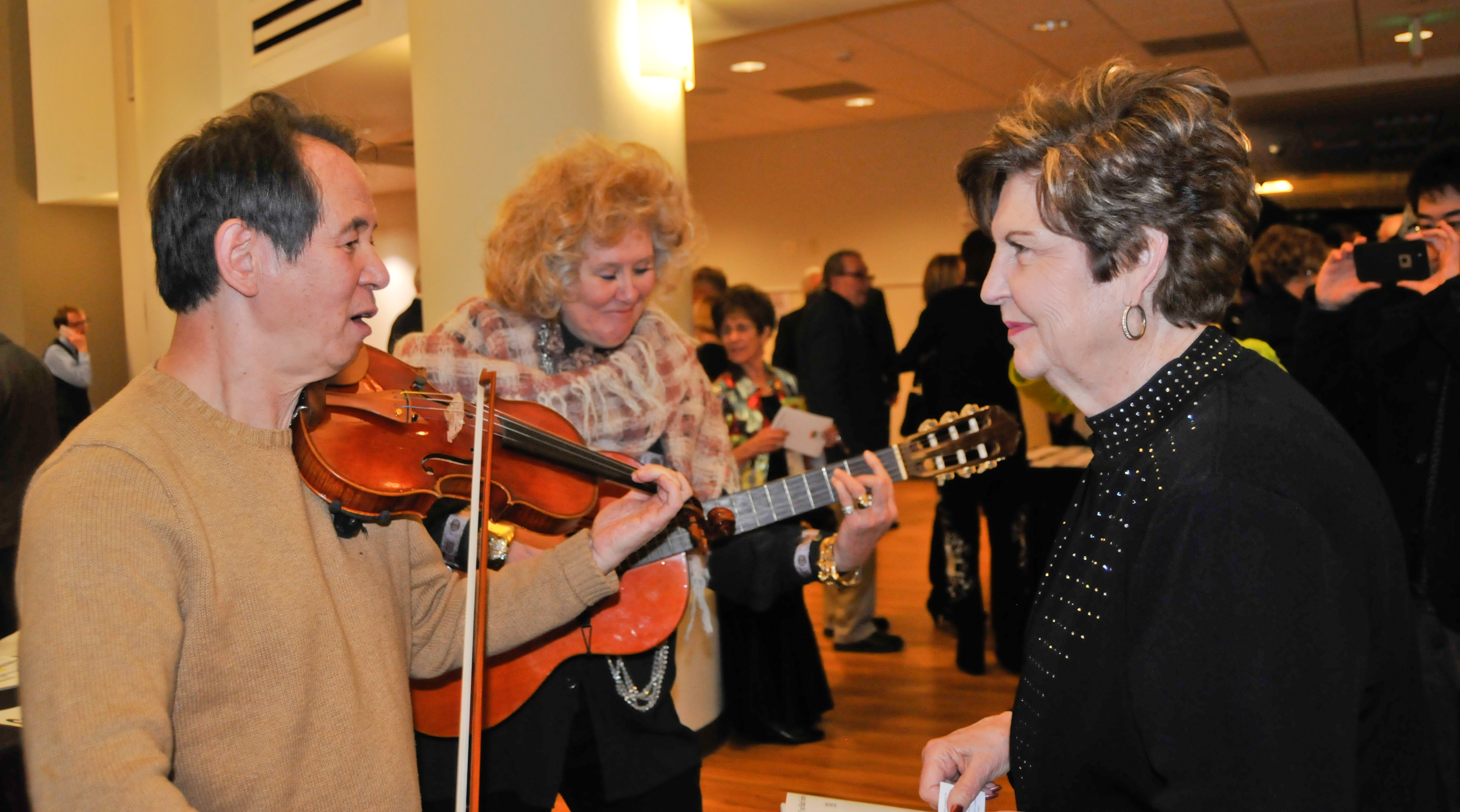 Dr. Jacob Chi and June King serenade honoree Neta DeRose
